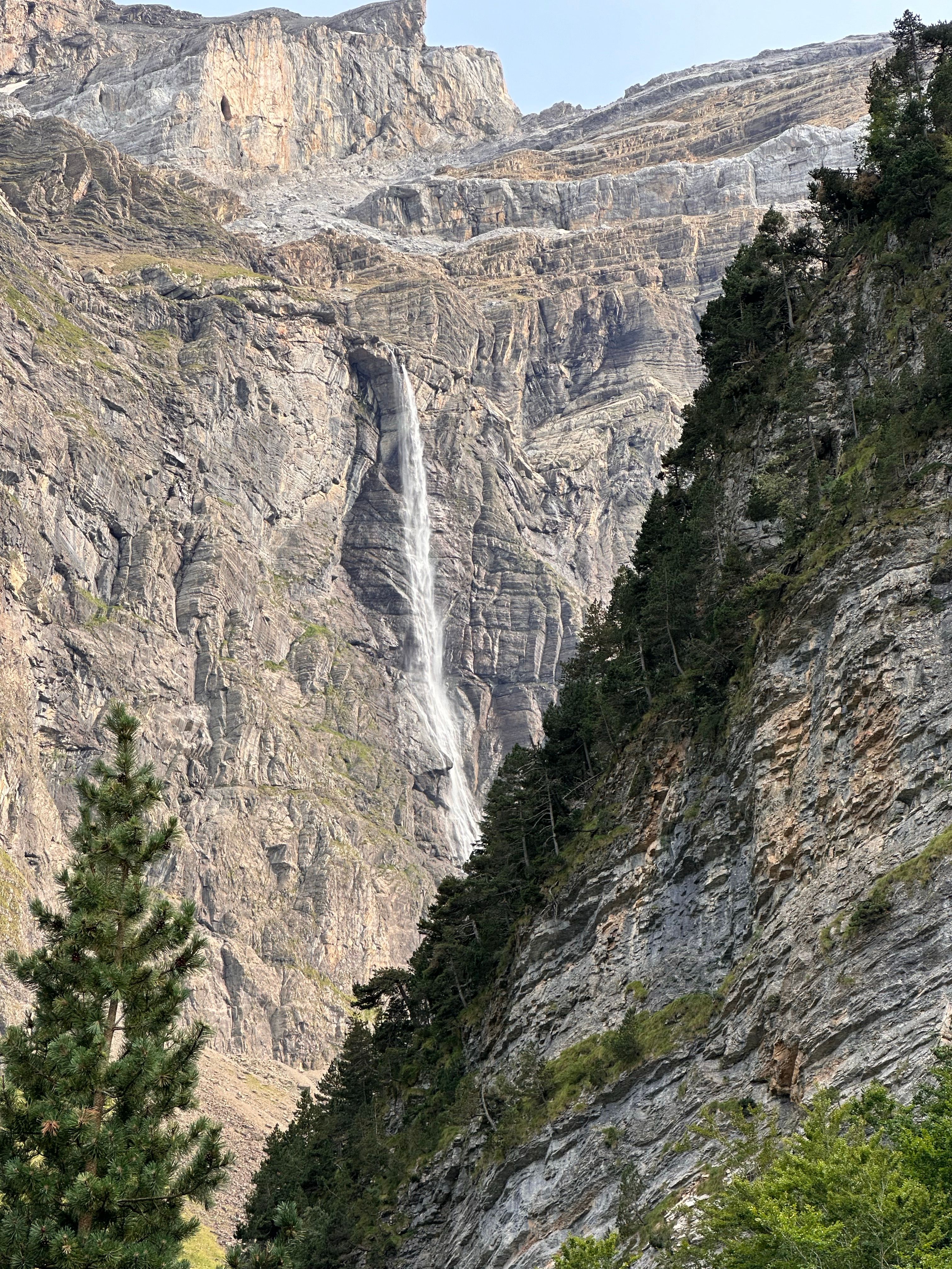 A waterfall is seen in the mountains · Free Stock Photo