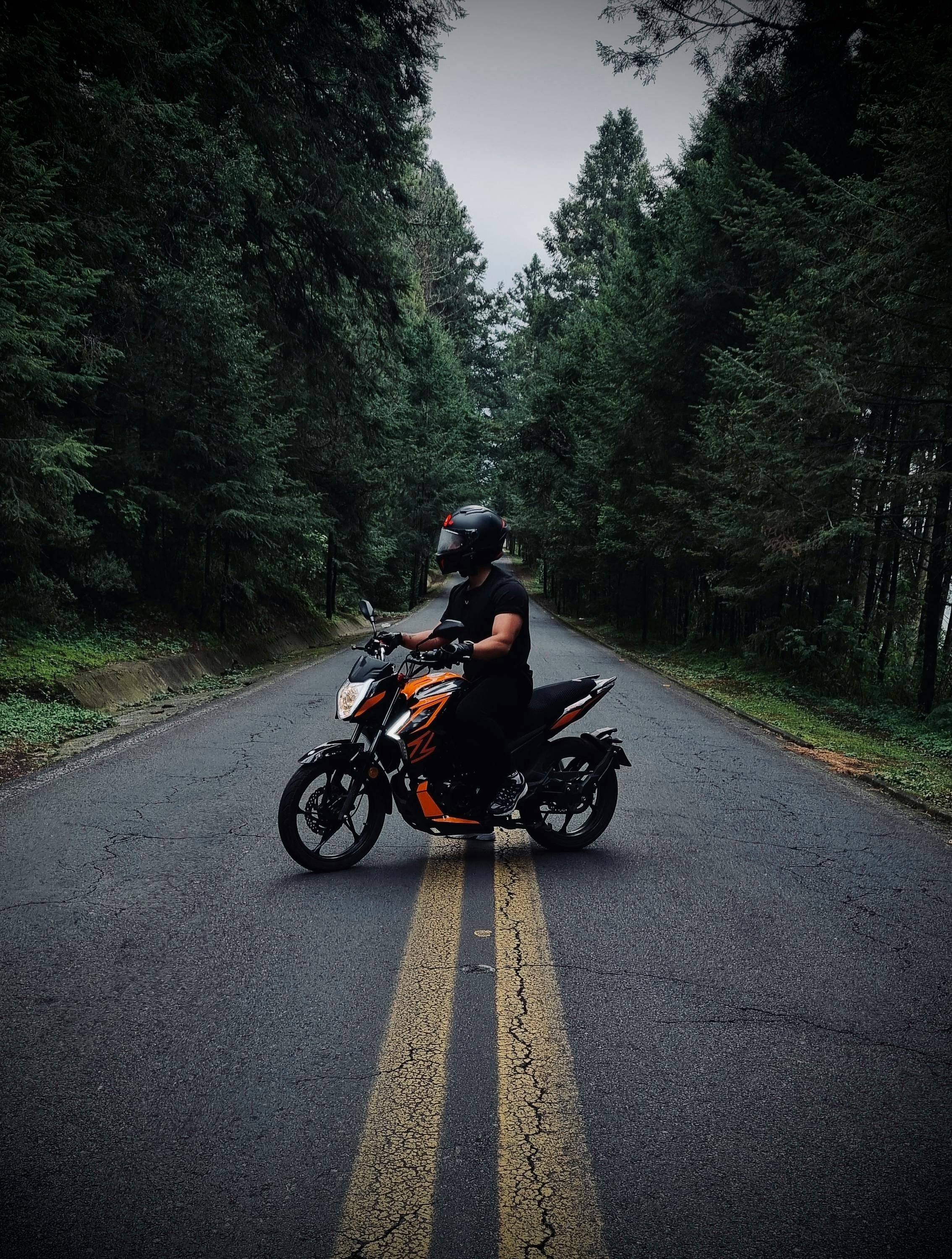 Man Riding a Motorcycle Photo · Free Stock Photo