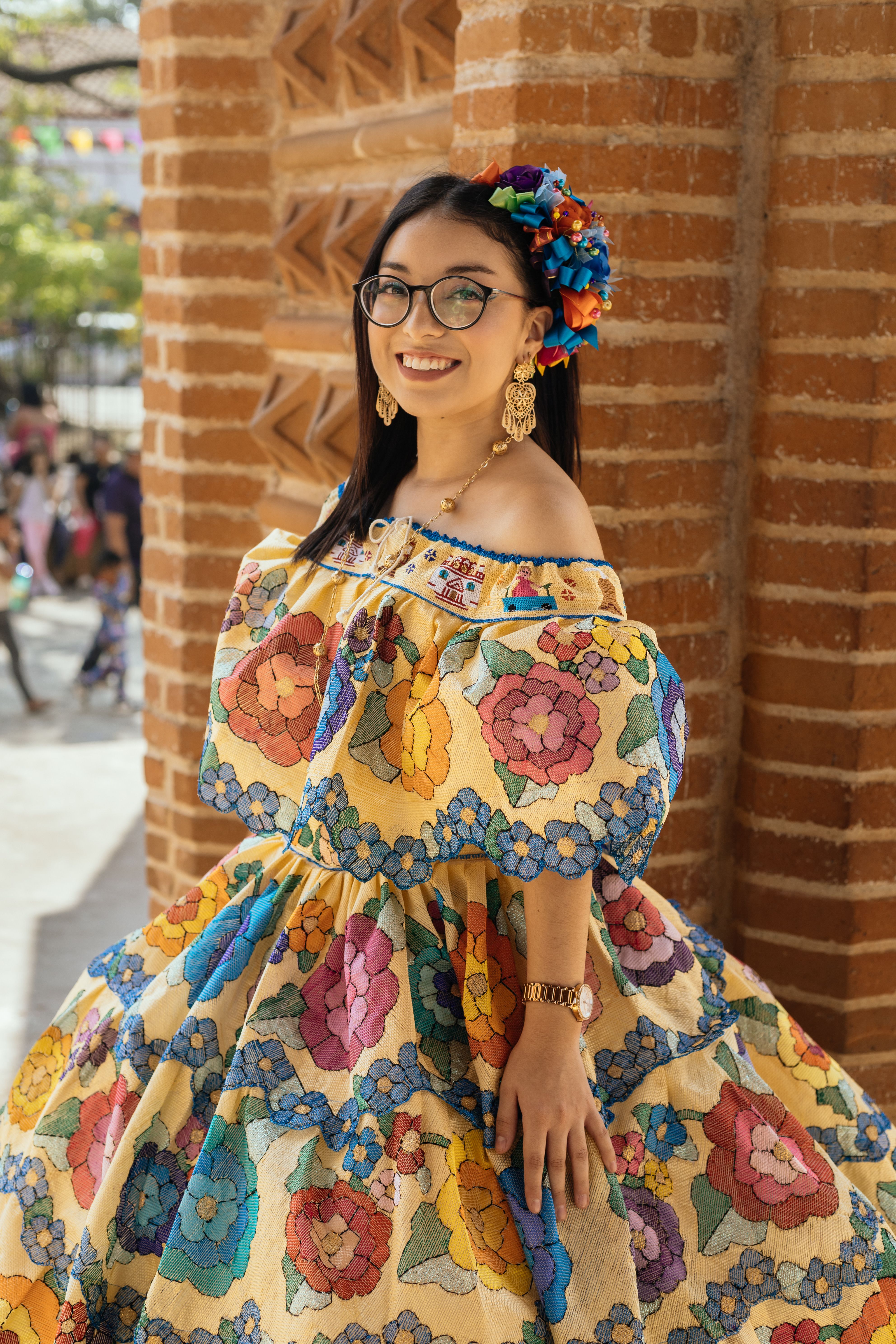 A woman in a colorful dress poses for a photo · Free Stock Photo