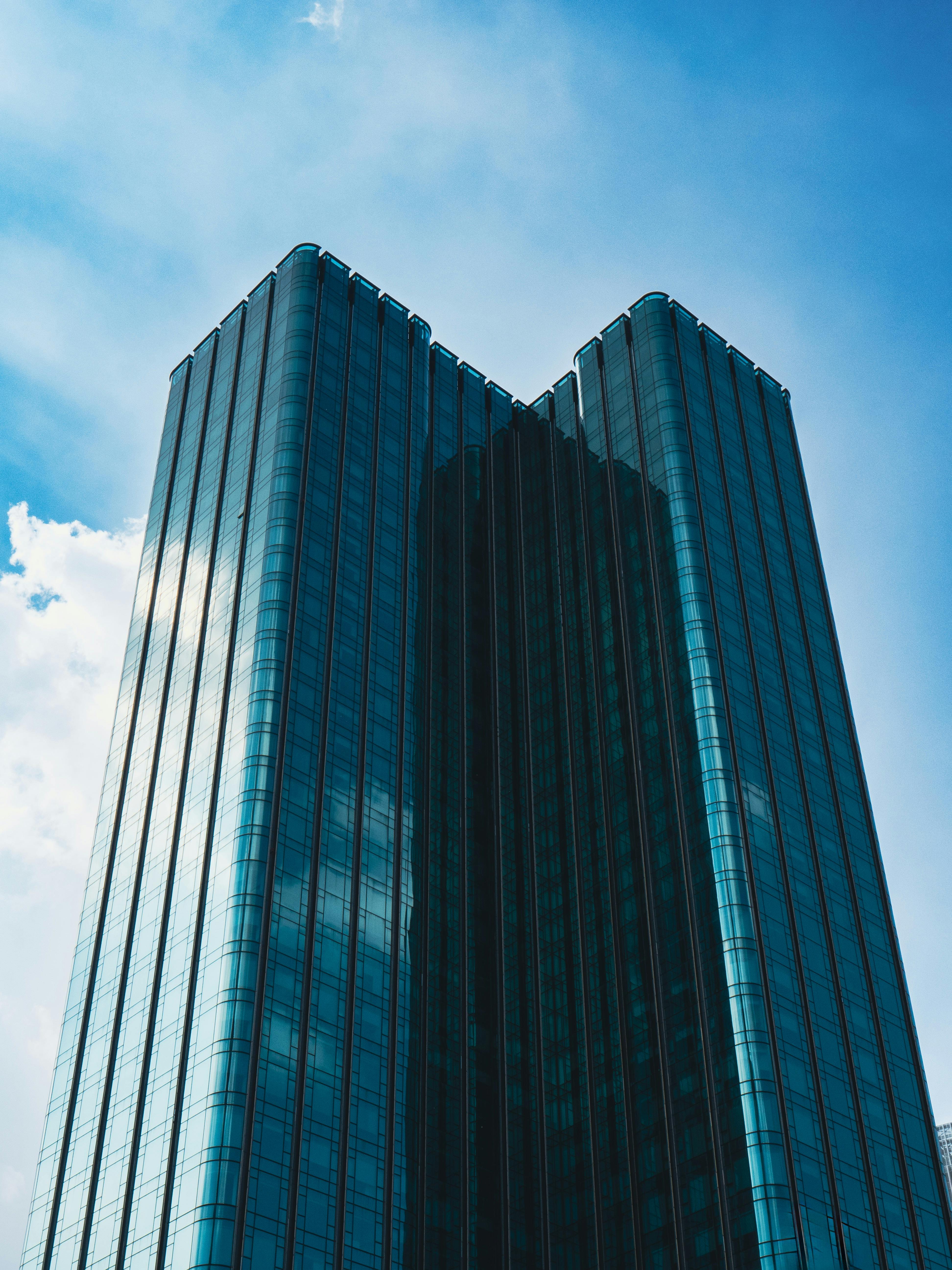 Reflection of Glass High-rise Building · Free Stock Photo