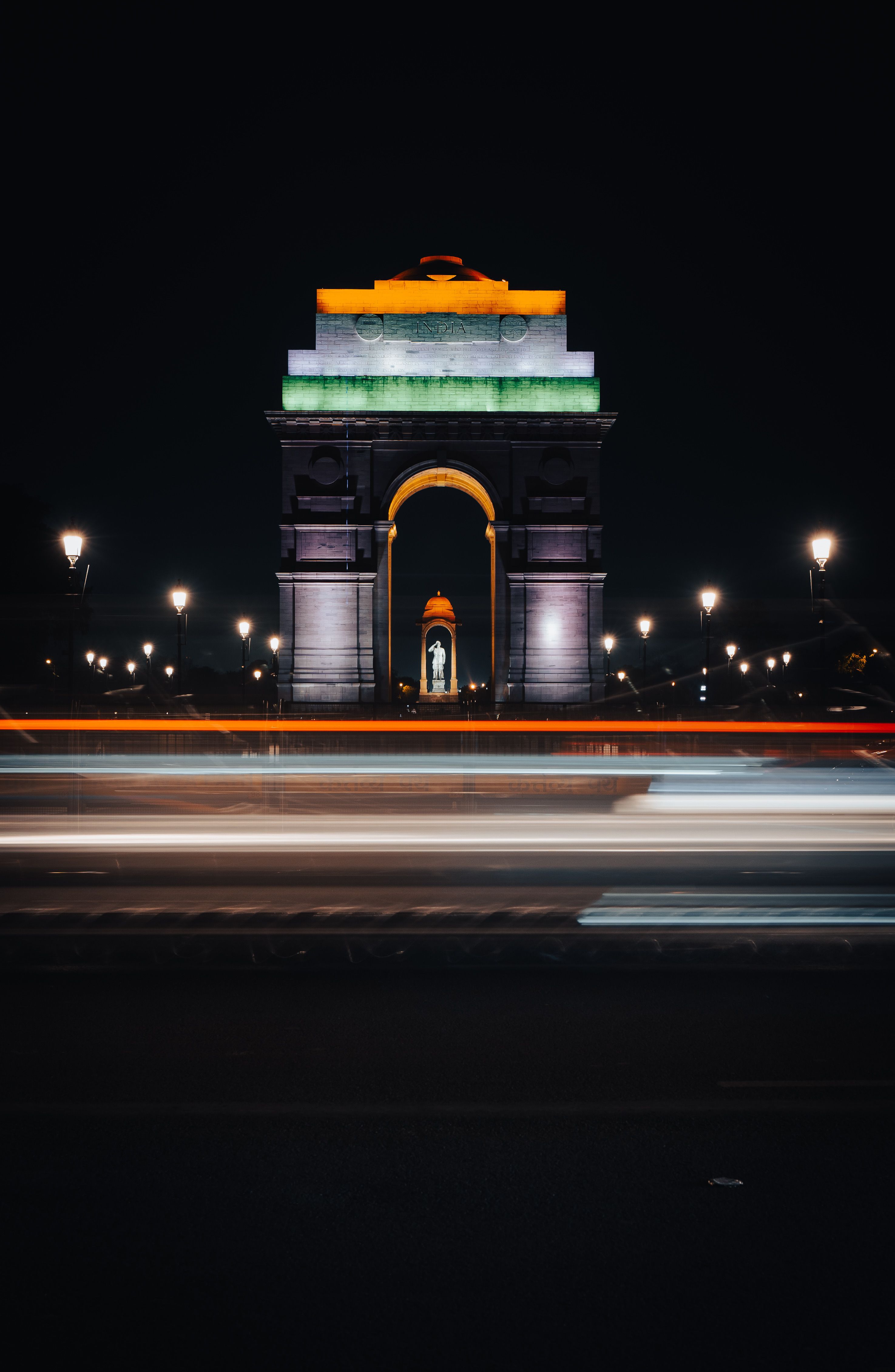The india gate at night with light trails · Free Stock Photo