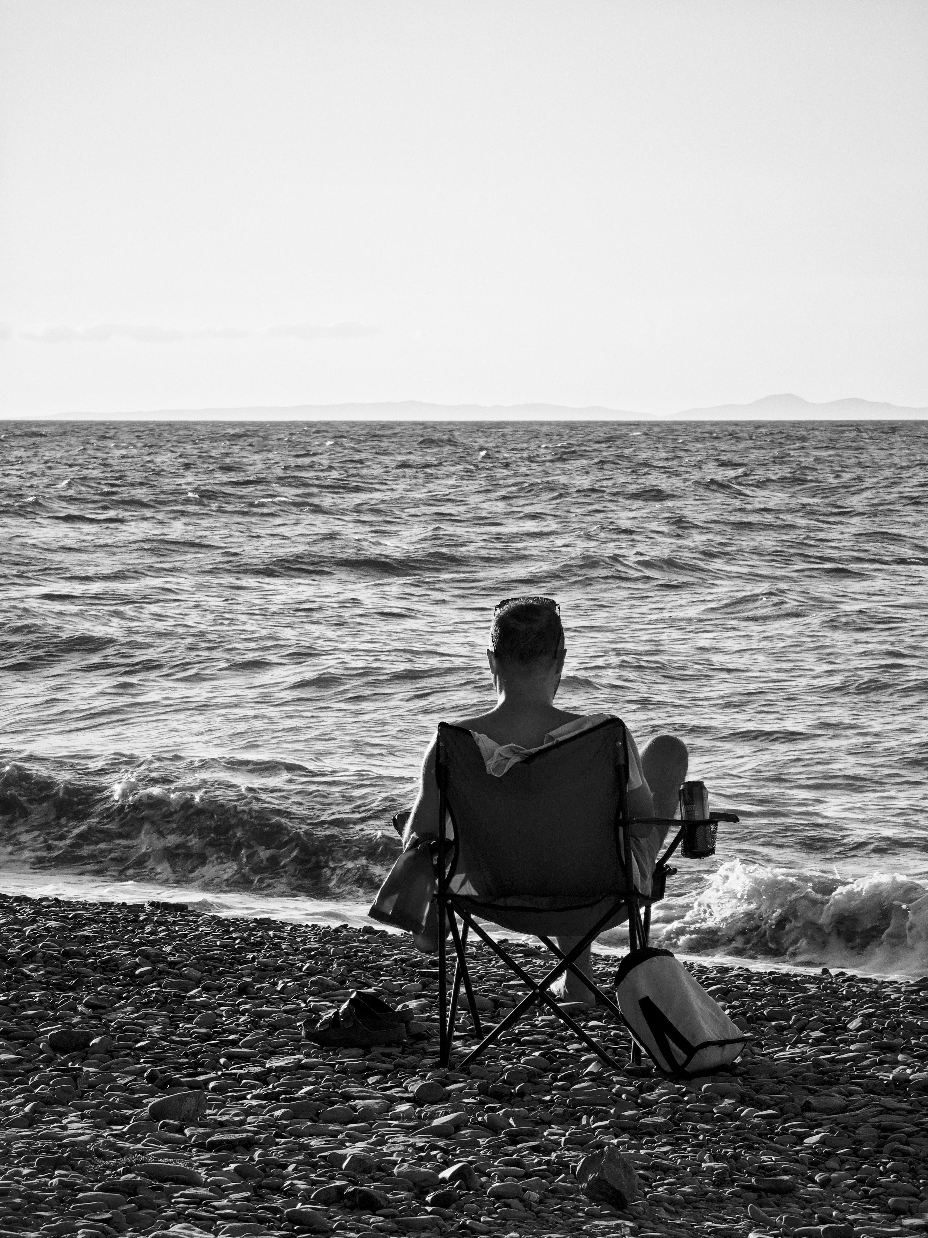 Man Sit On Chair Alone With Sea And Montain Photos, Download The BEST ...