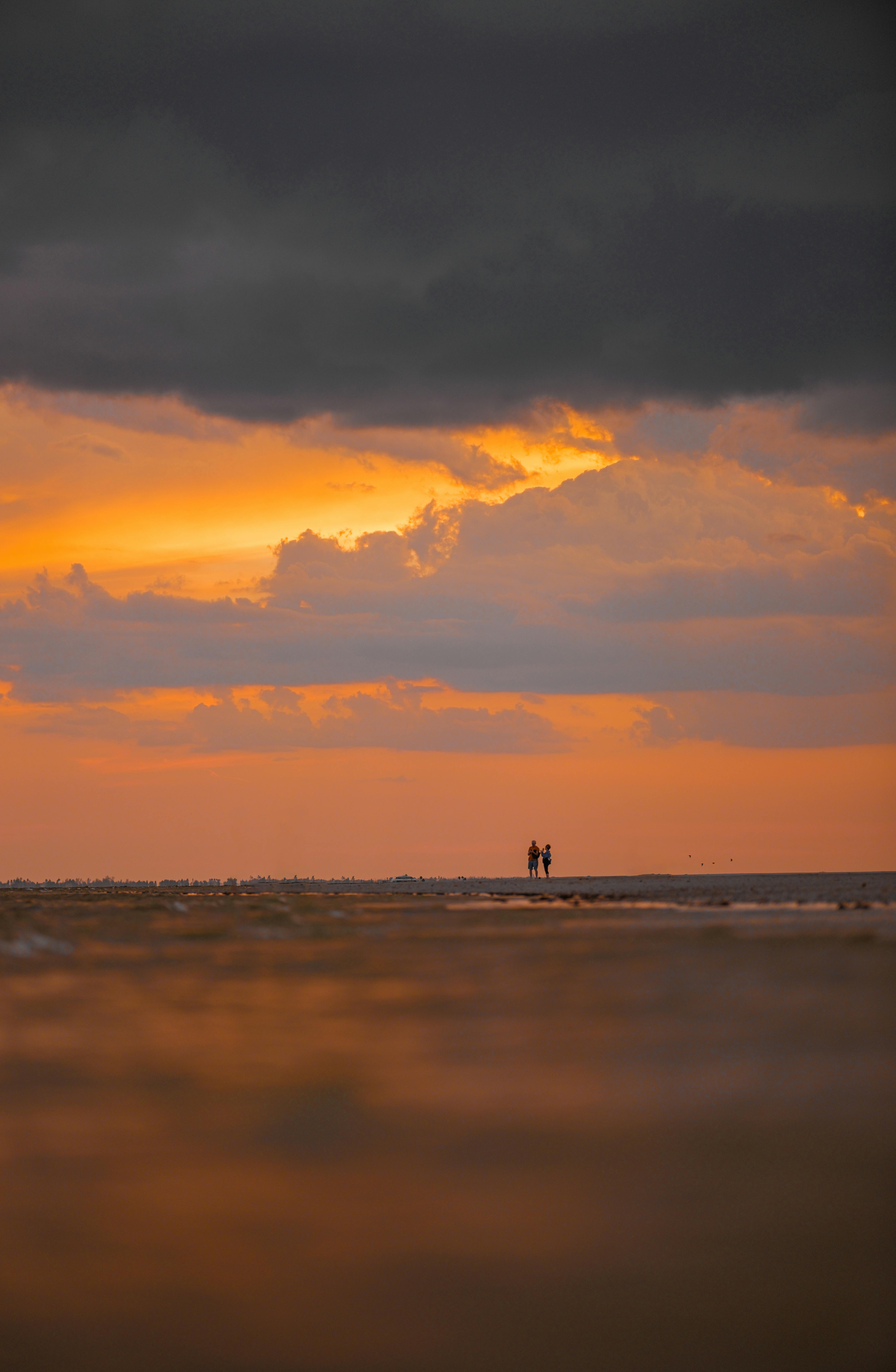 White Sand Beach Under Cloudy Sky during Sunset · Free Stock Photo