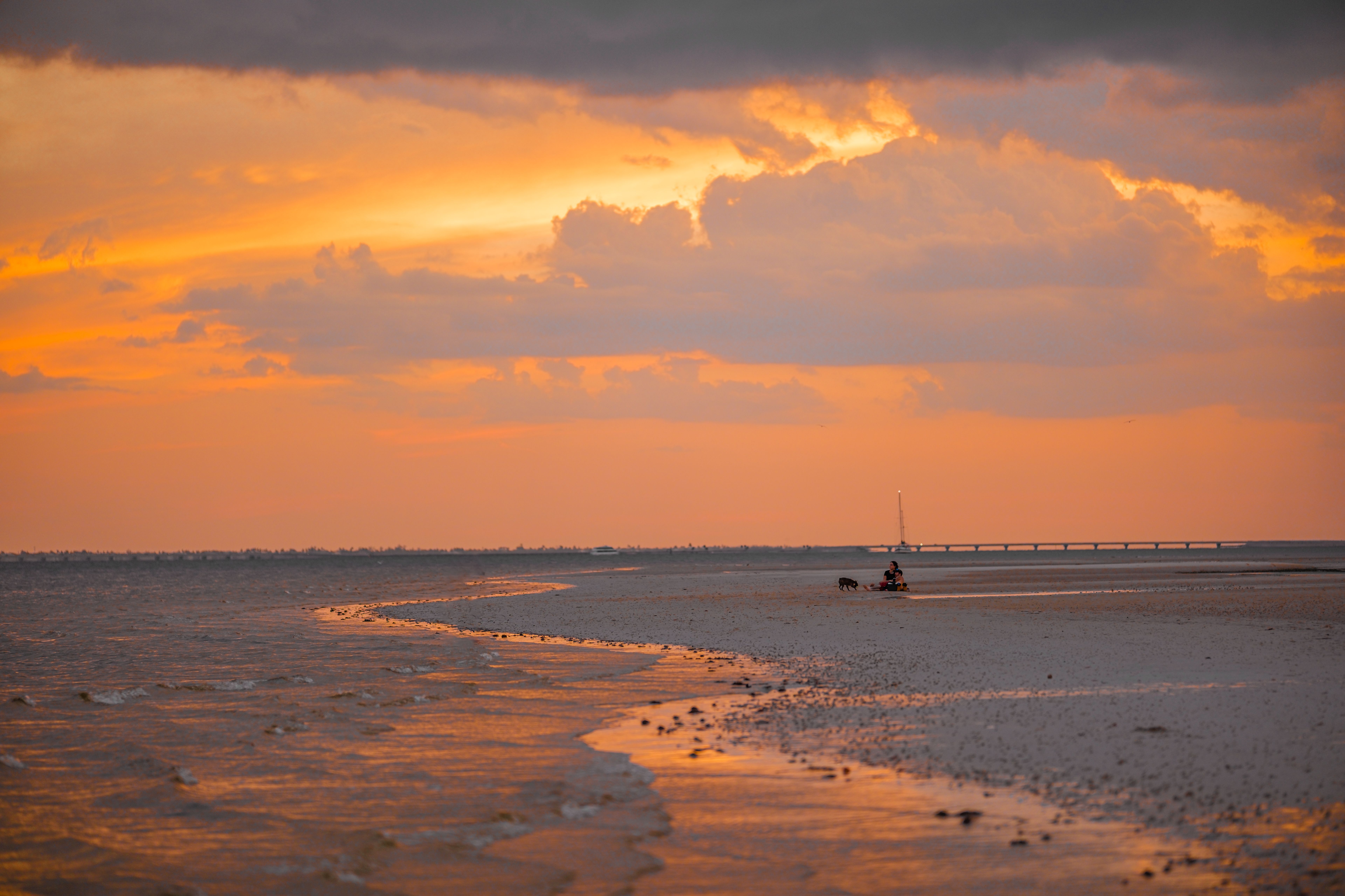 A boat on the beach at sunset · Free Stock Photo