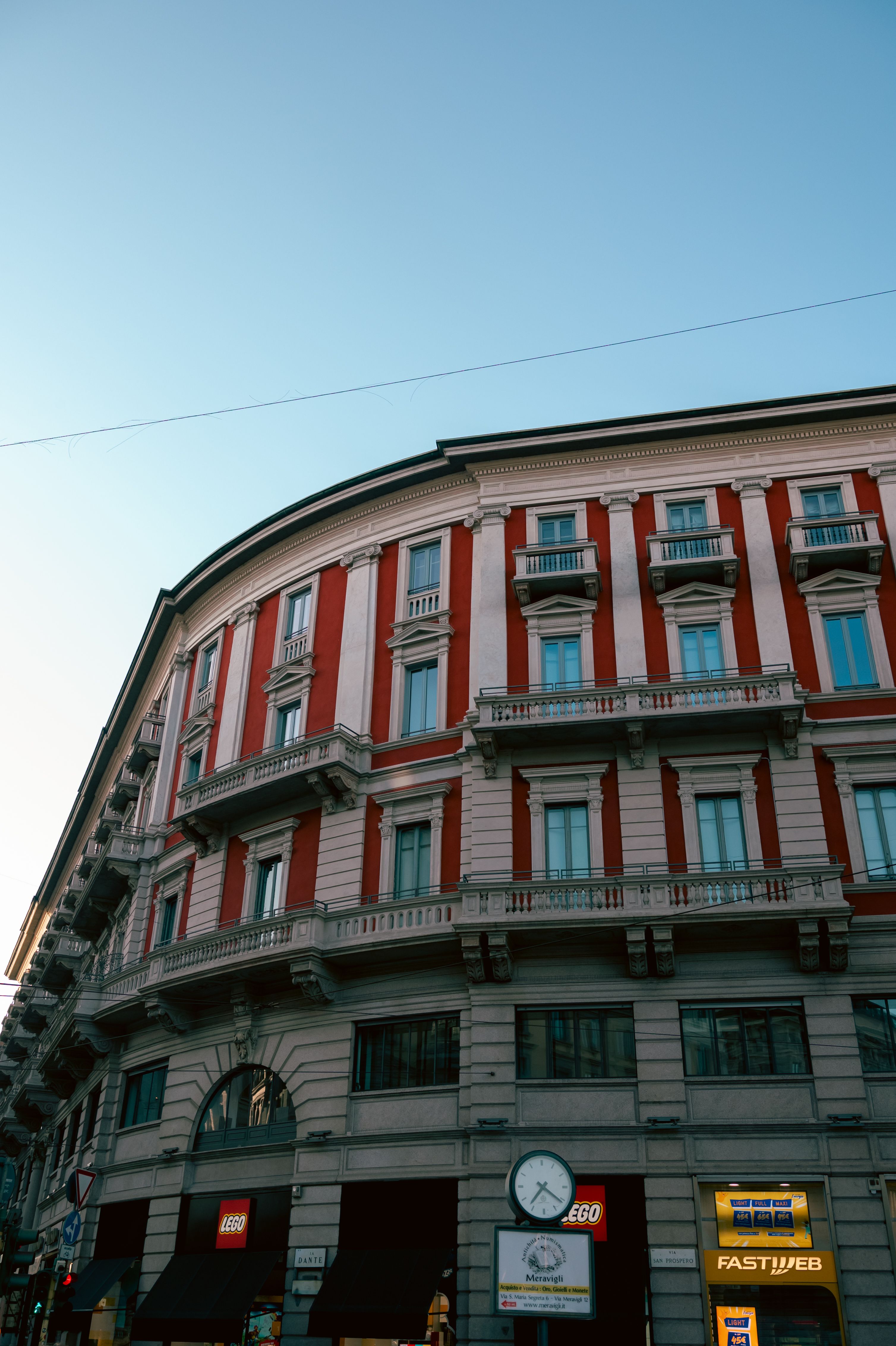 A building with a clock on it's side · Free Stock Photo