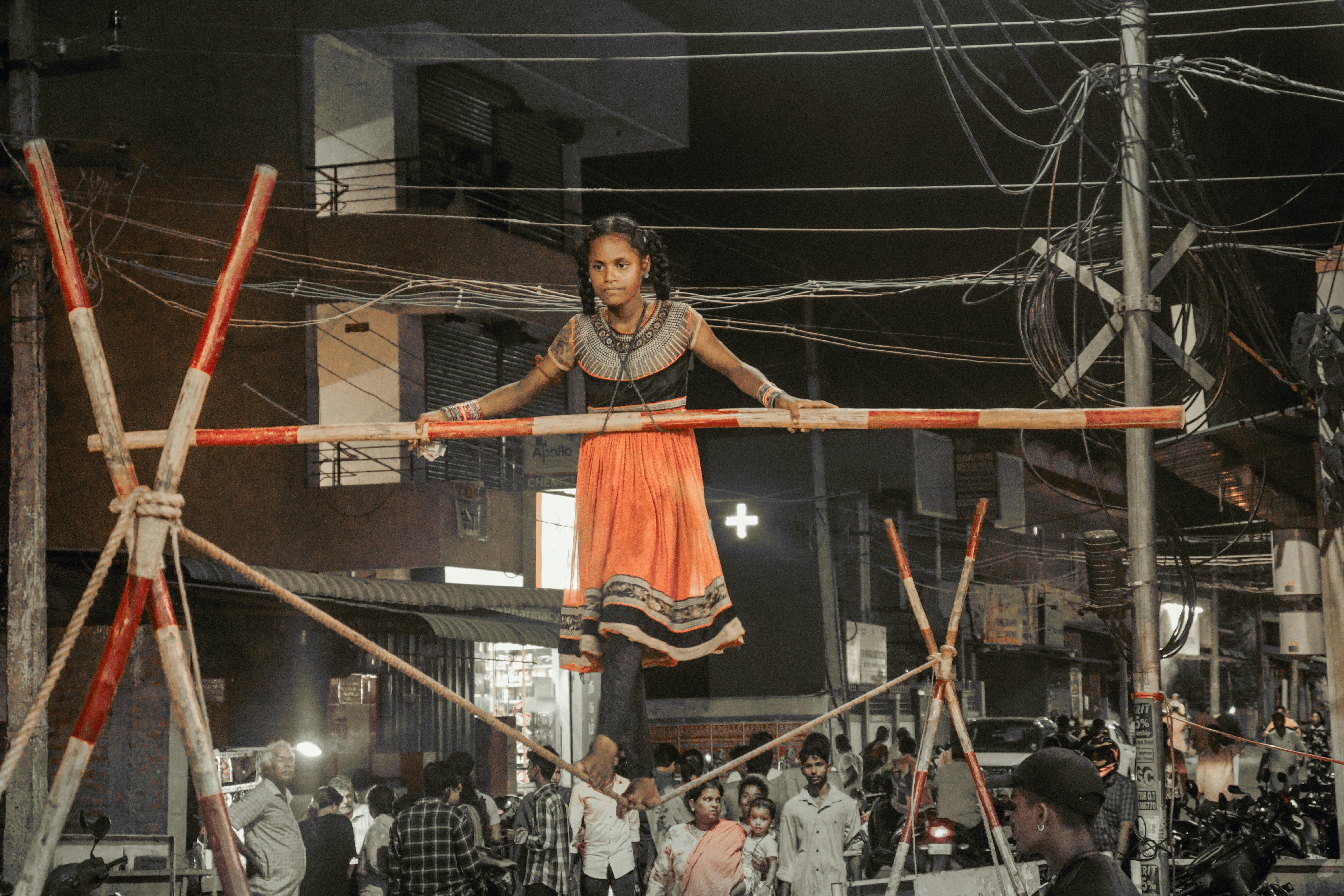 poor indian girl walking on a rope · Free Stock Photo