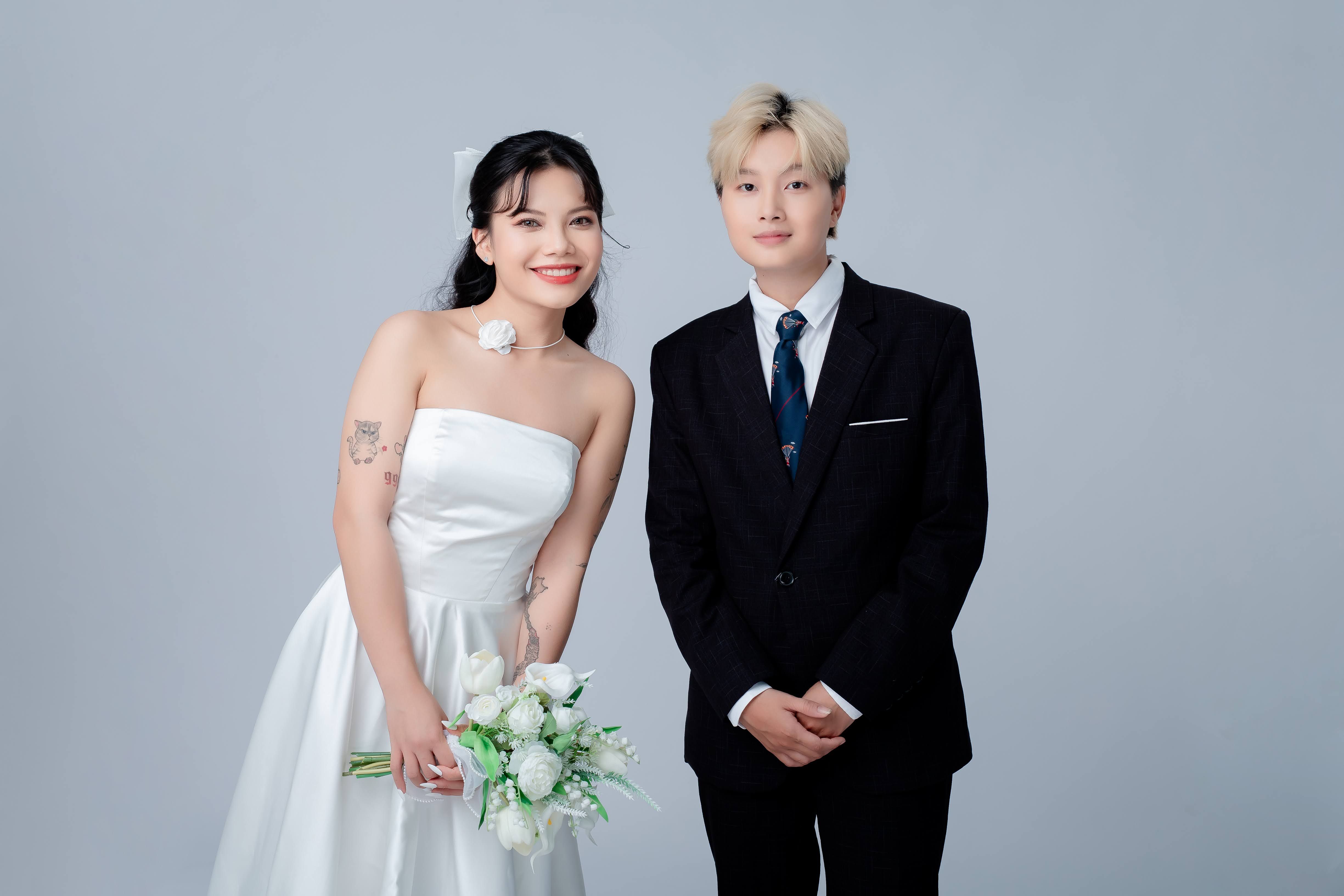 A man and woman in wedding attire posing for a photo · Free Stock Photo
