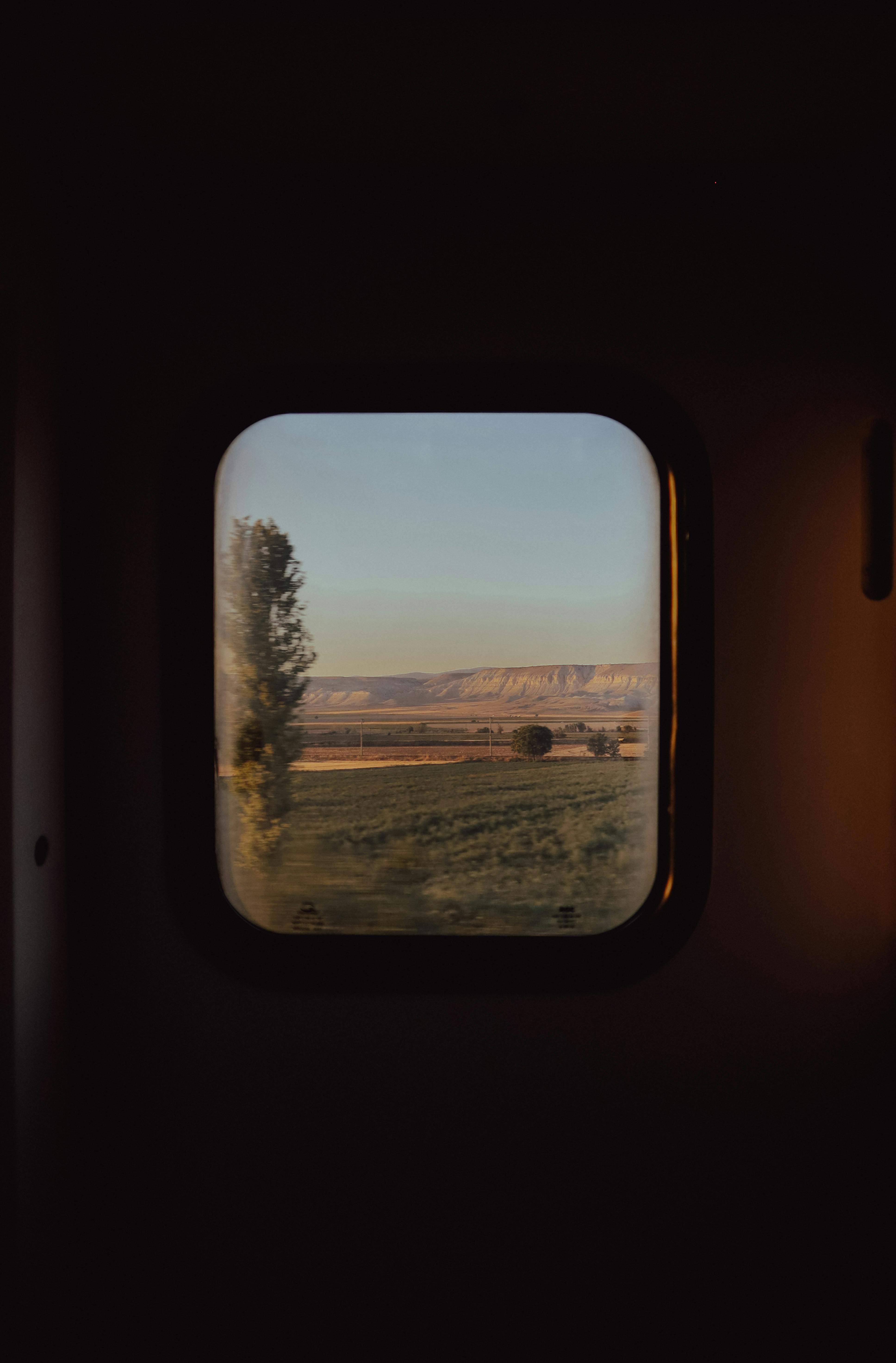 A view of the countryside from a train window · Free Stock Photo