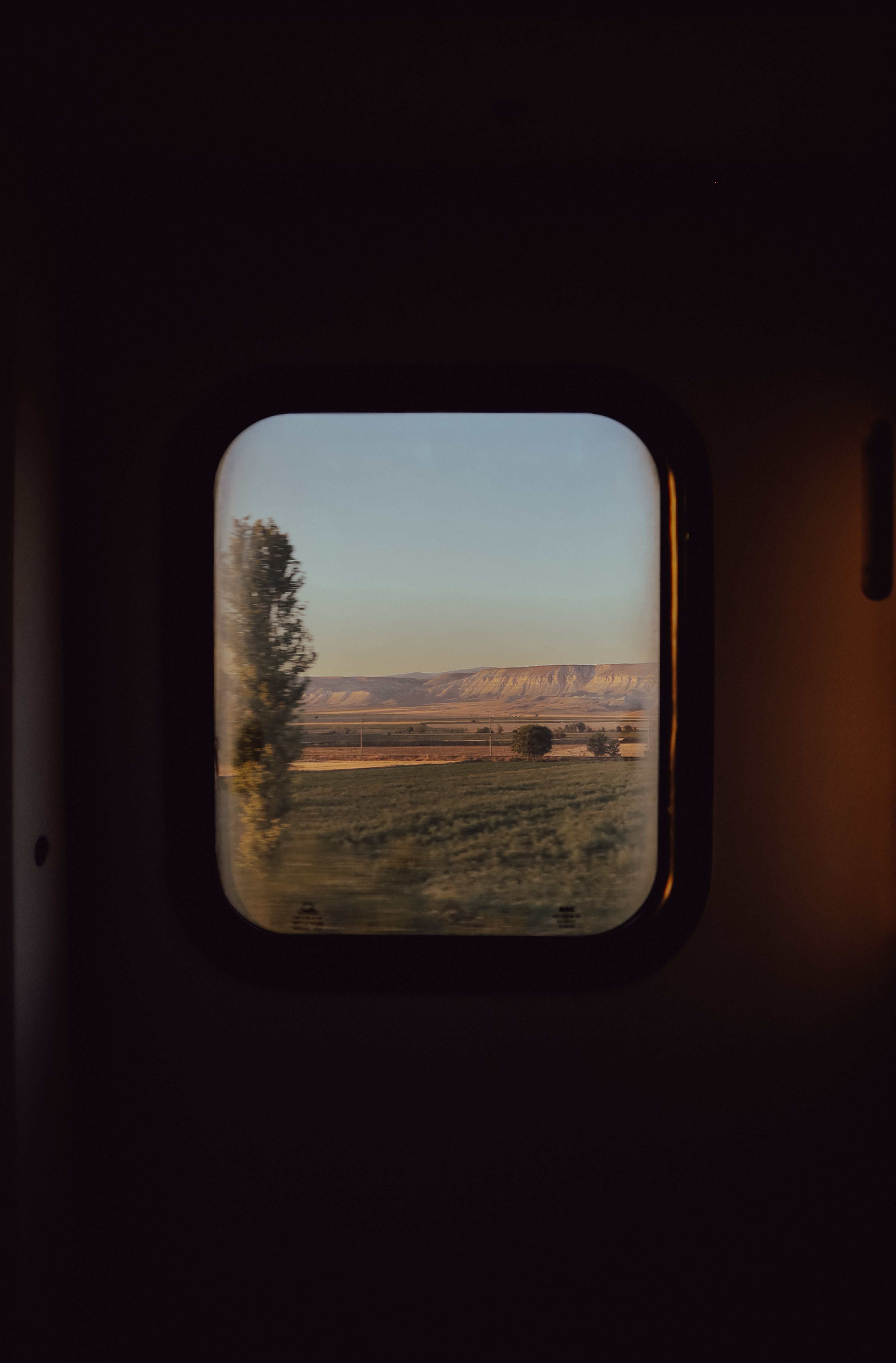 A view of the countryside from a train window · Free Stock Photo