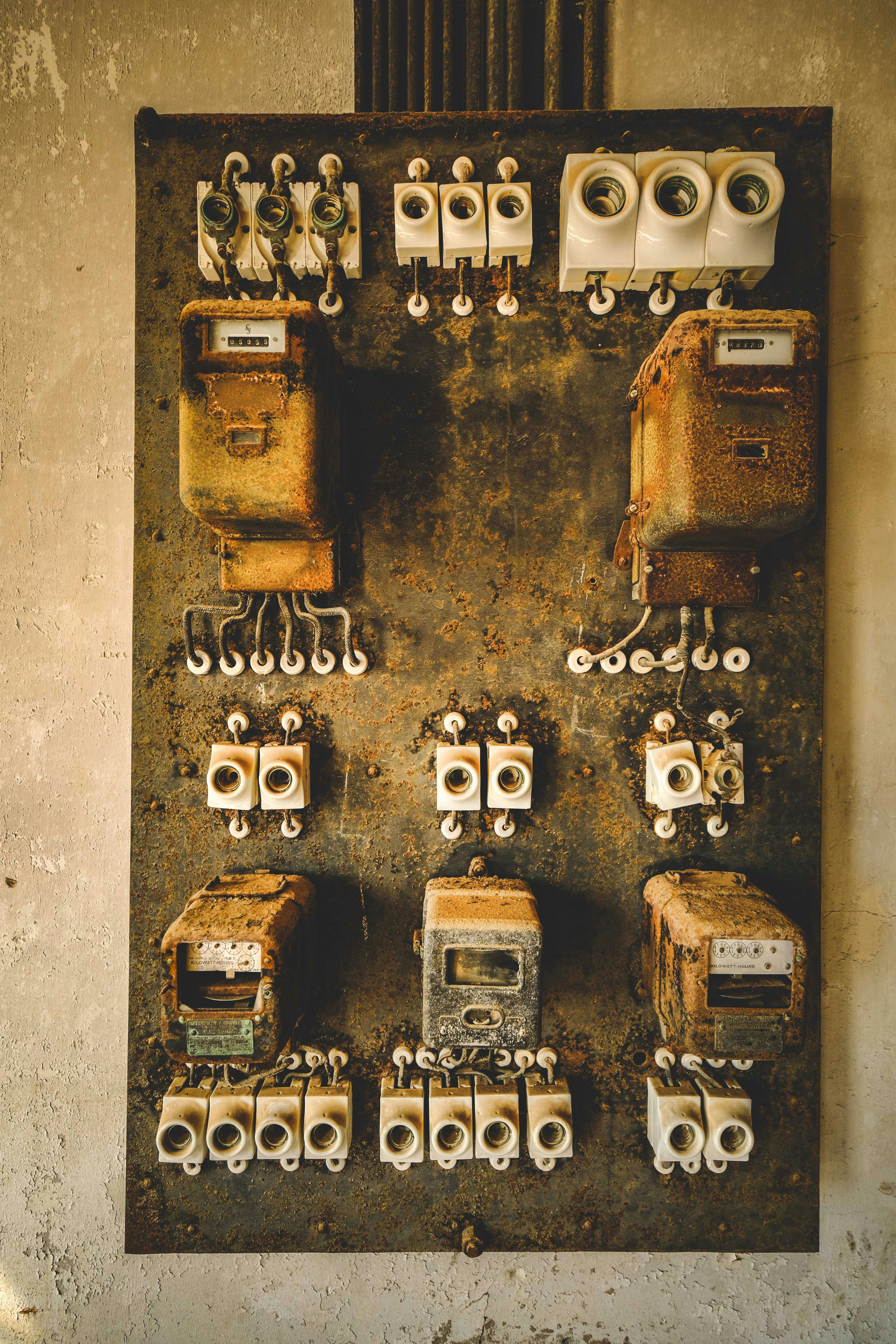 An old electrical panel with many different electrical devices · Free ...