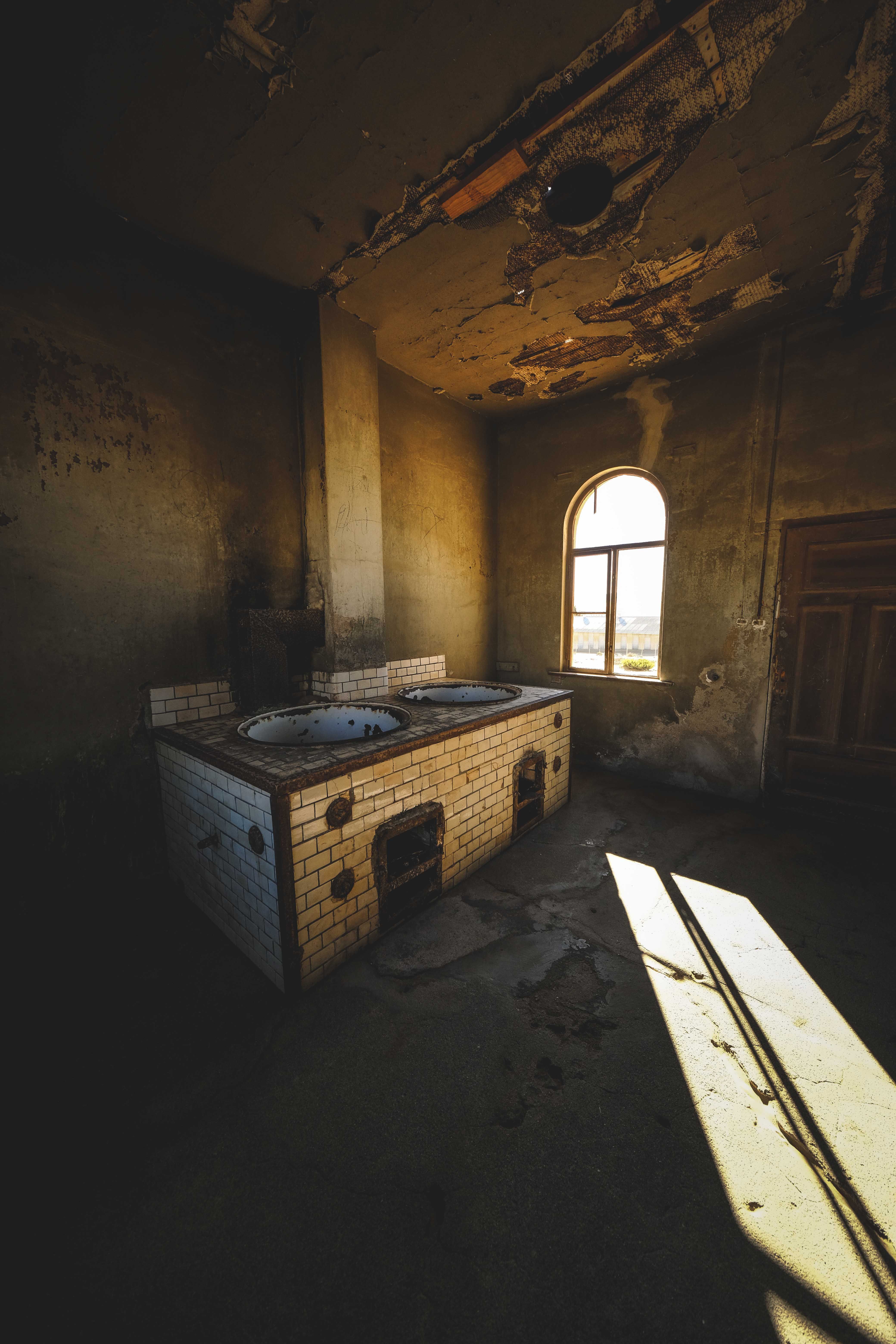 An old kitchen in an abandoned building · Free Stock Photo