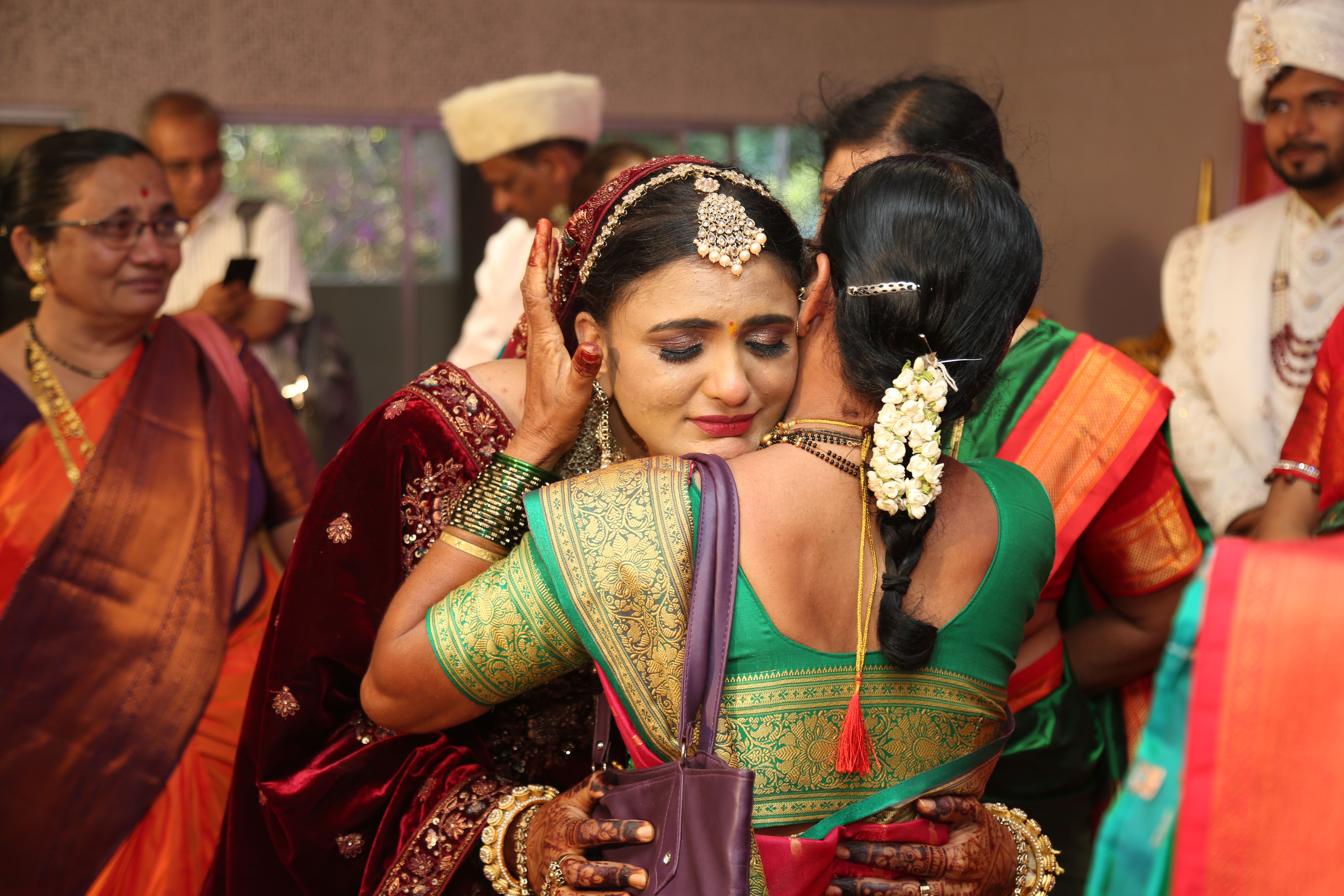 A woman in traditional indian attire hugging another woman · Free Stock ...