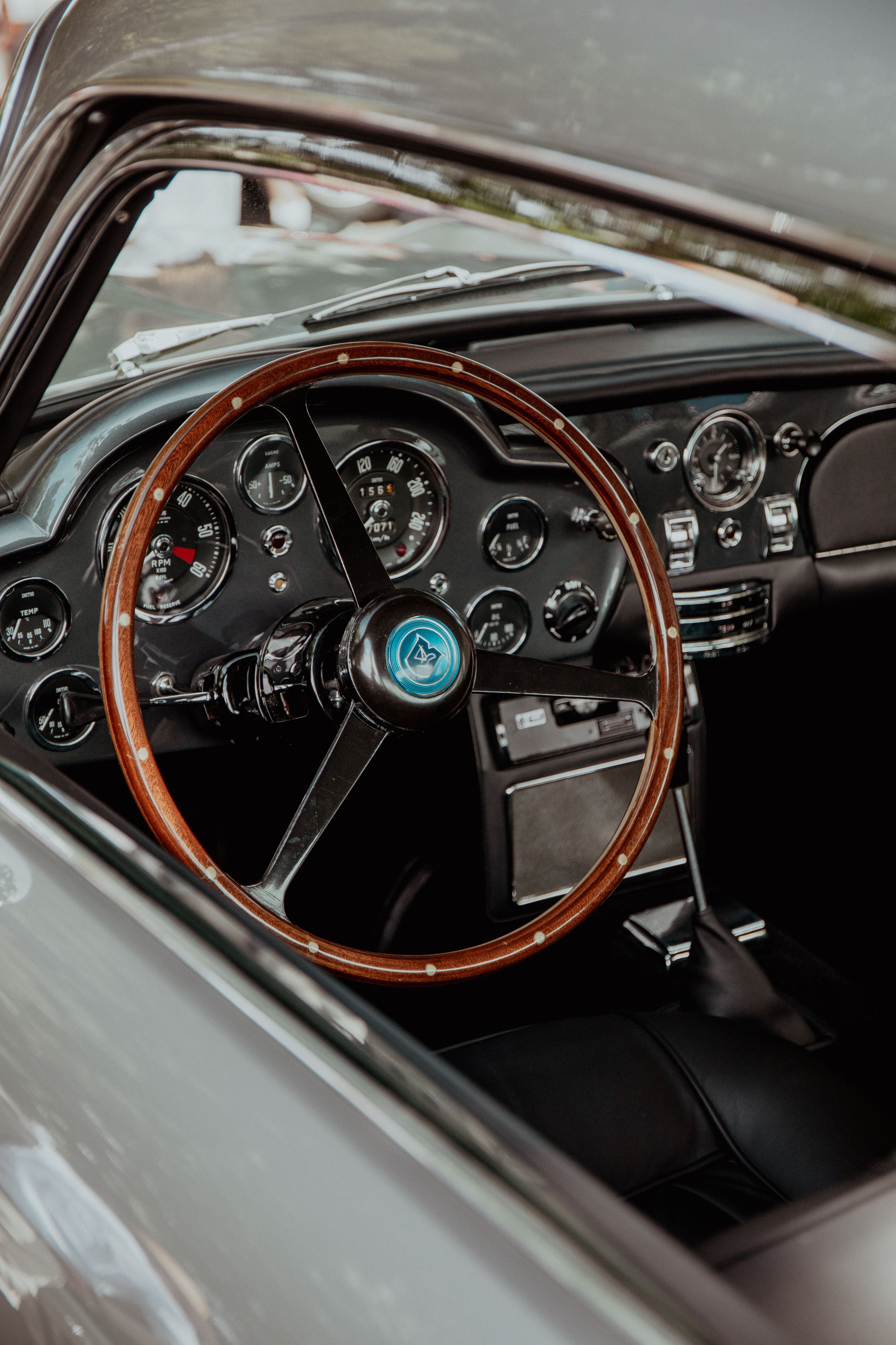 The steering wheel and dashboard of a classic car · Free Stock Photo