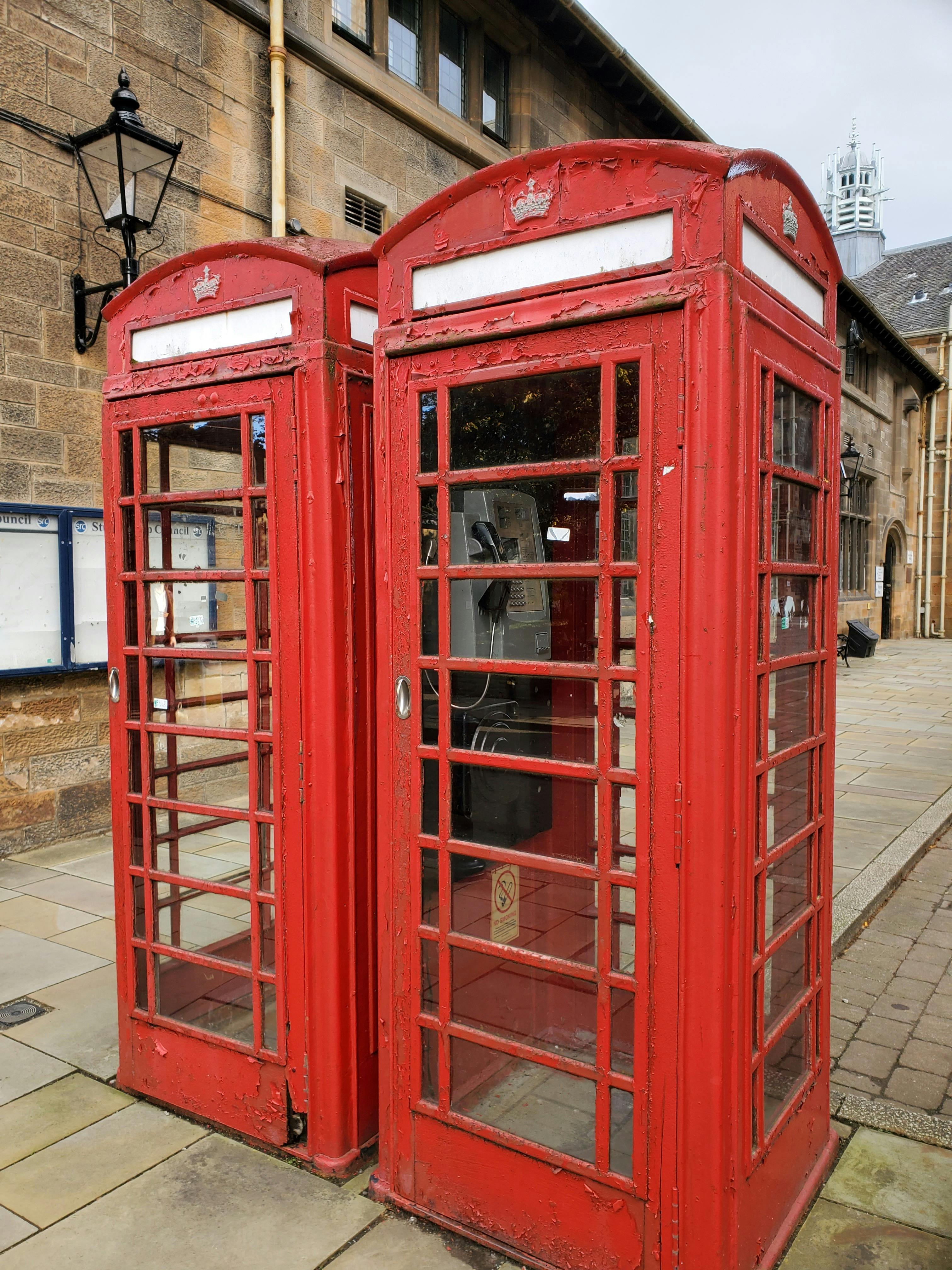 Photo Of Red Telephone Booth Under Blue Sky · Free Stock Photo