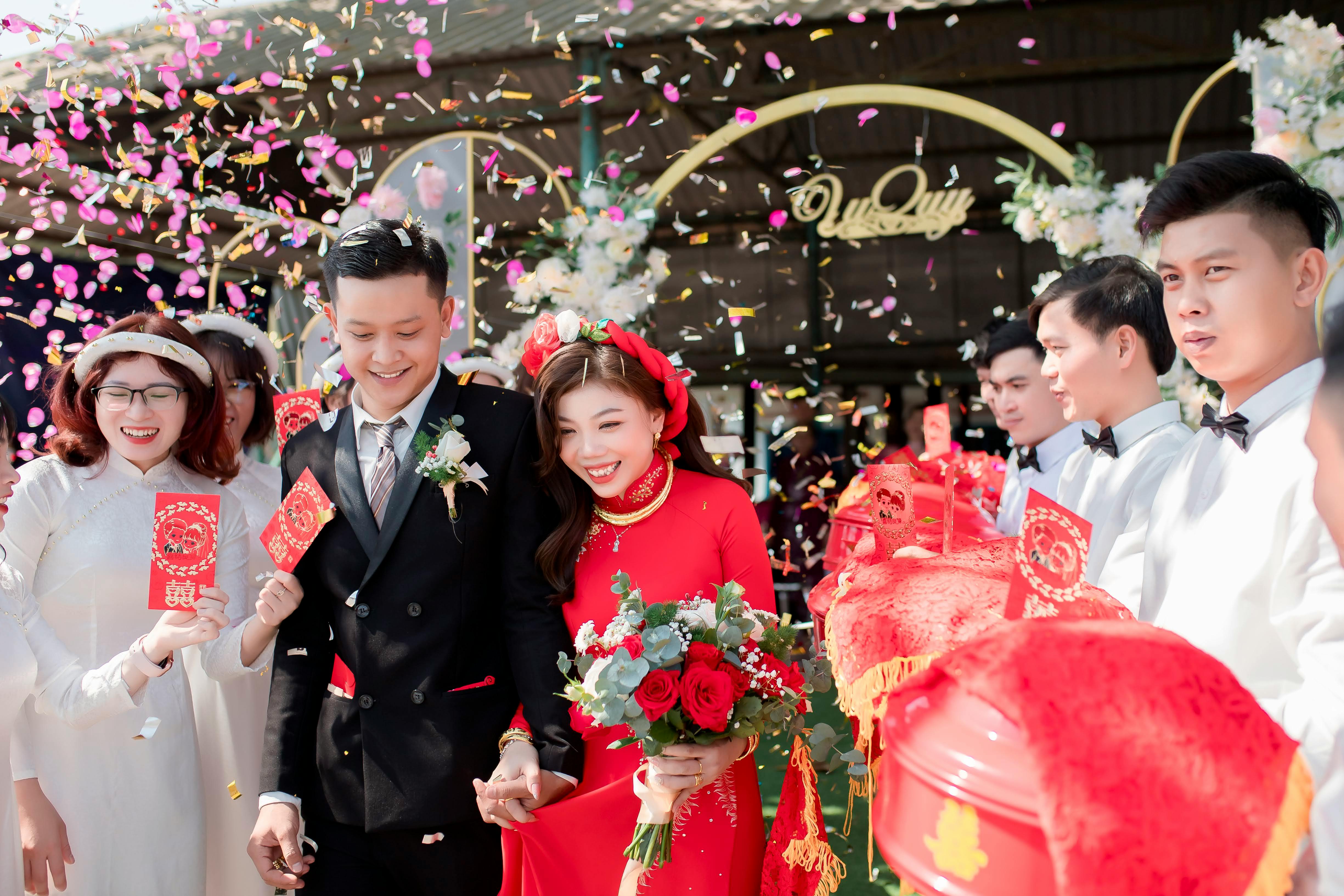 A couple in traditional vietnamese wedding attire · Free Stock Photo