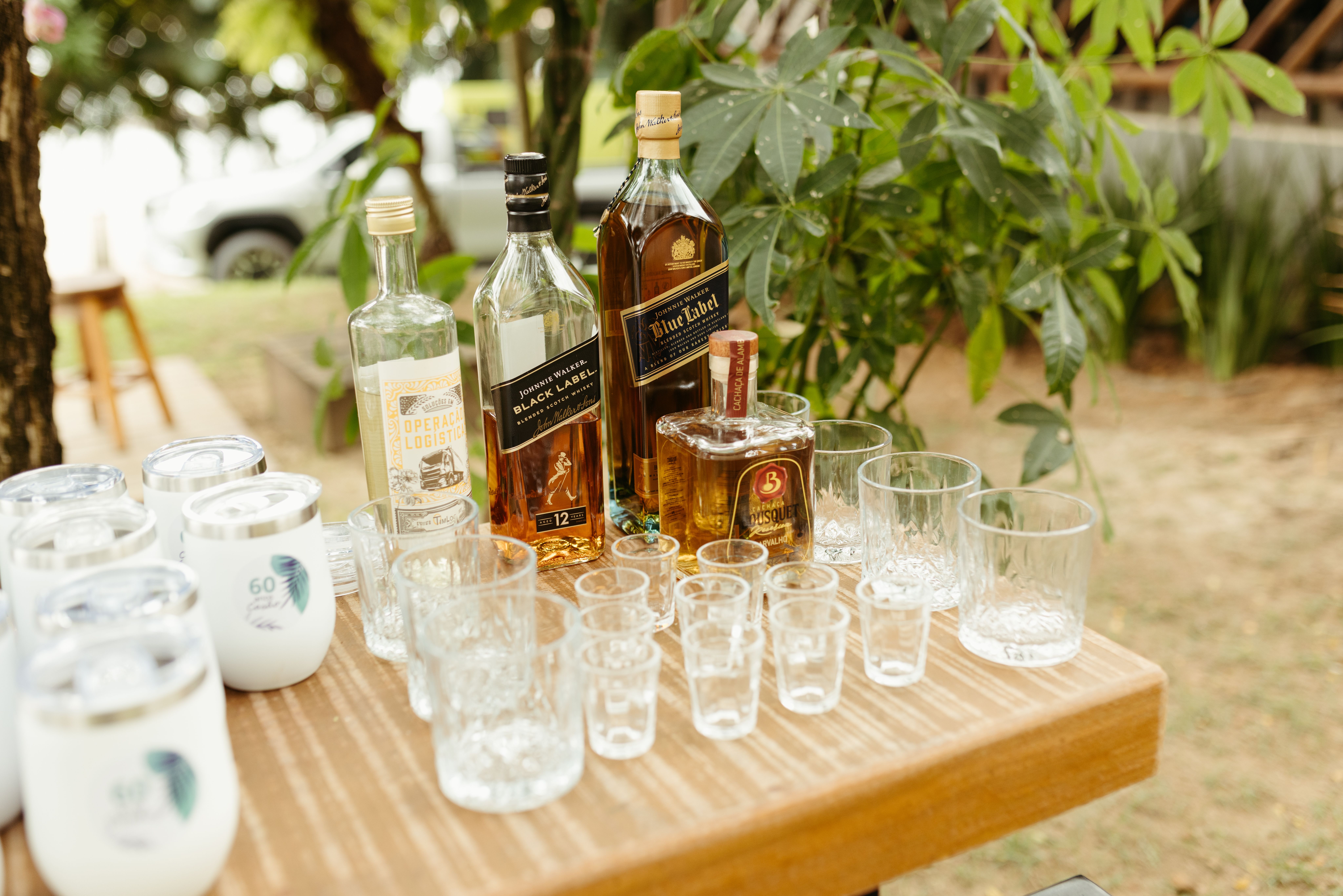 A table with bottles of alcohol and glasses · Free Stock Photo