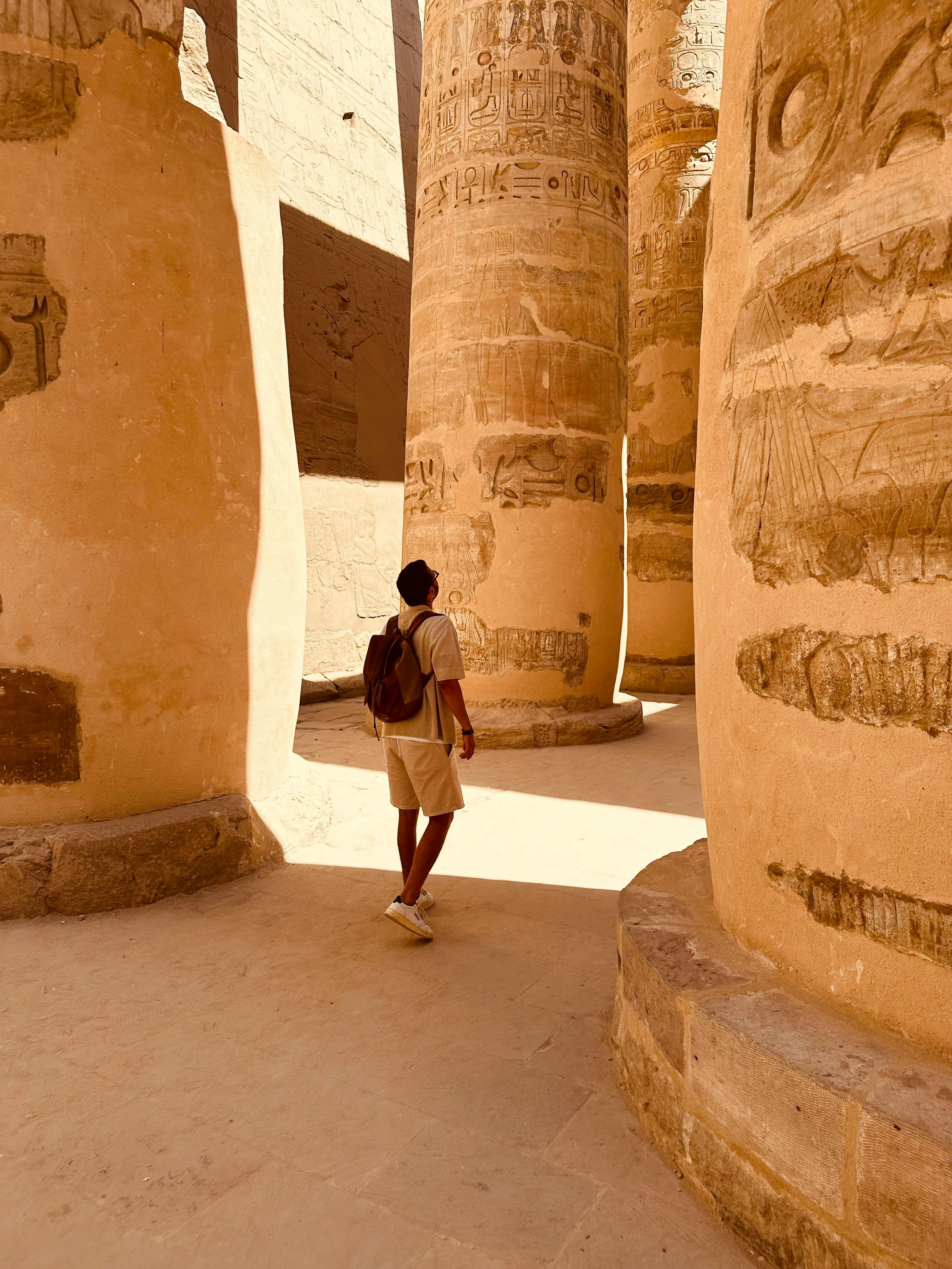 Woman in a Beige Coat at Luxor Temple, Luxor, Egypt · Free Stock Photo
