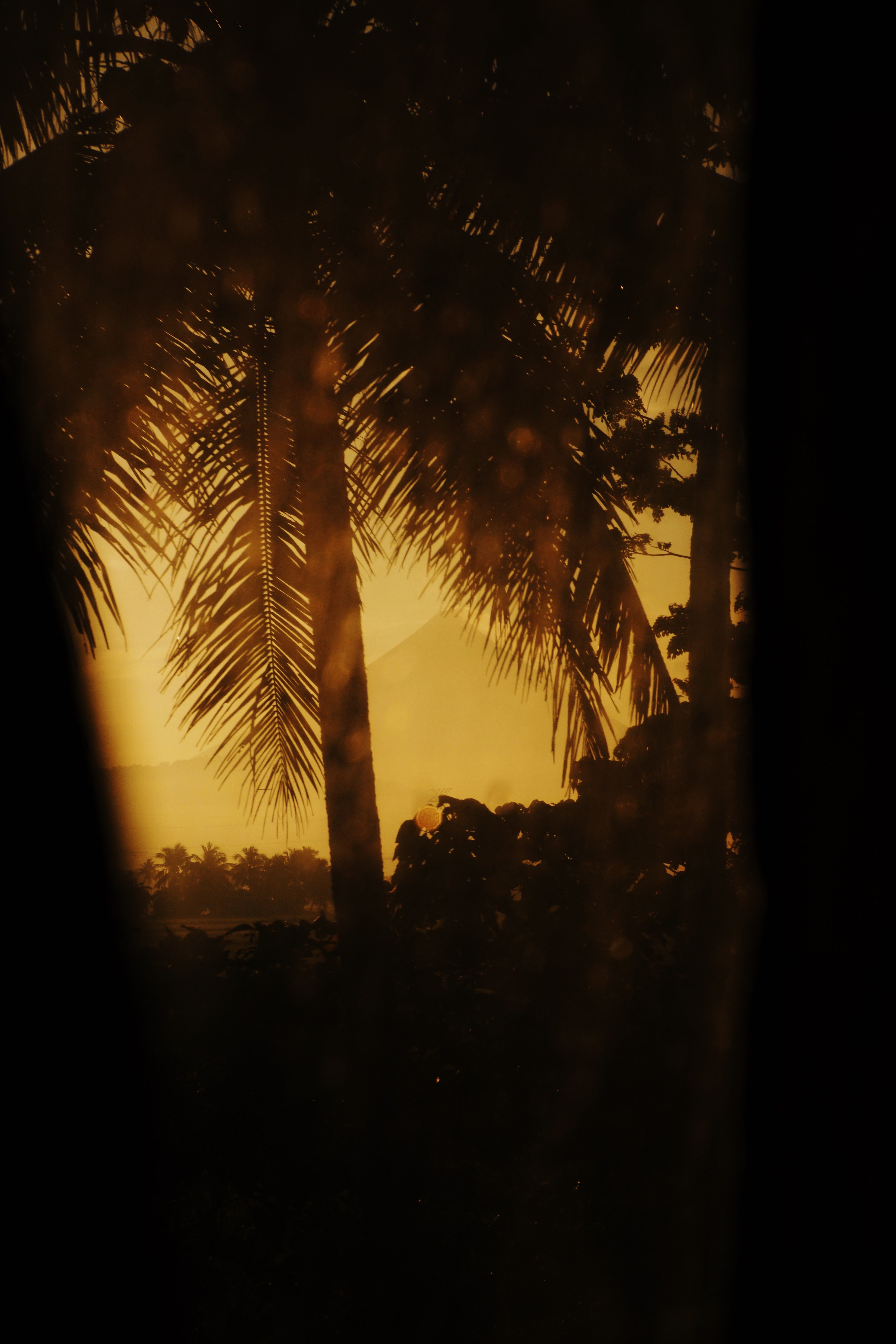 A view of the sunset through a window · Free Stock Photo