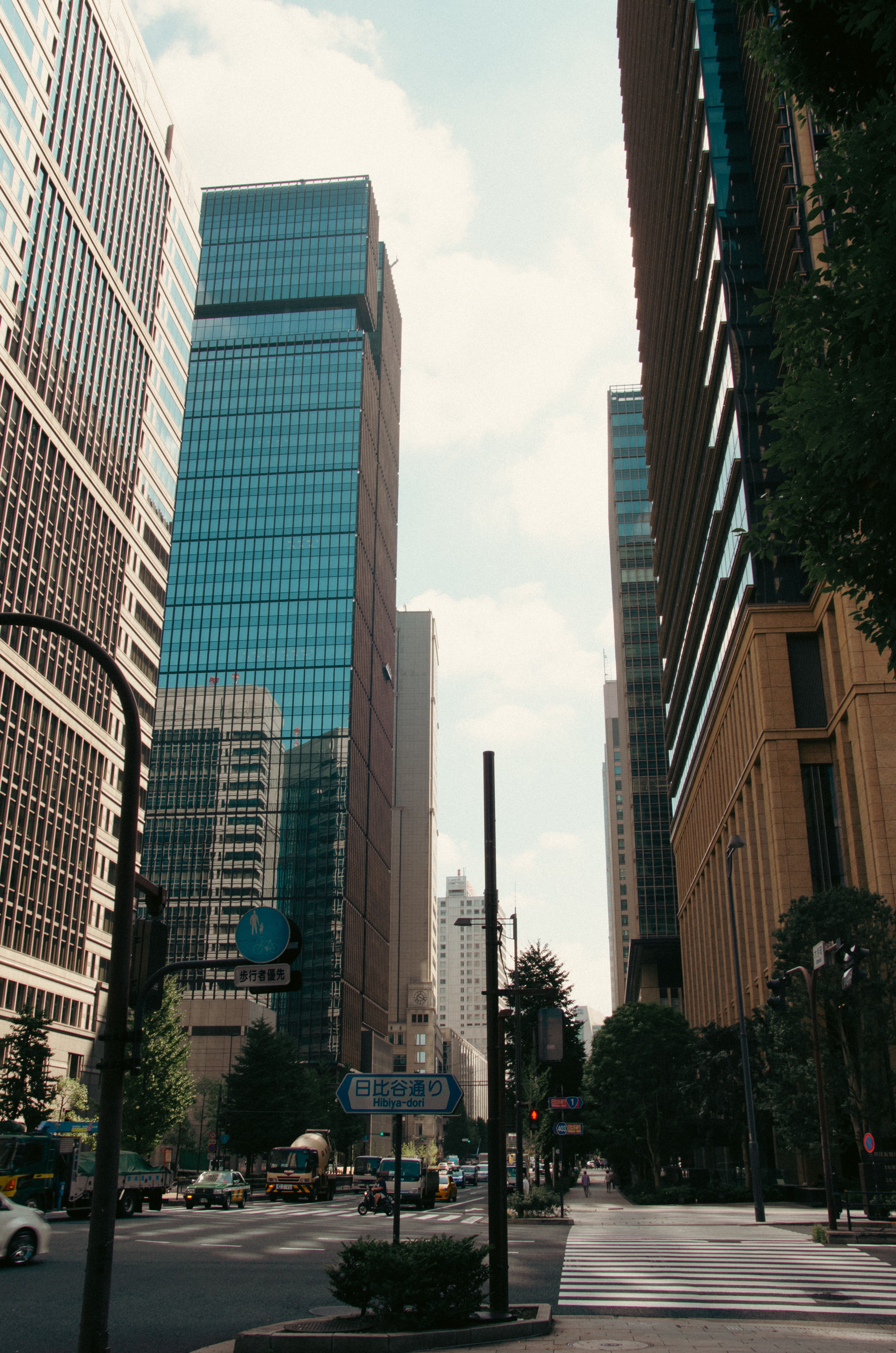 A city street with tall buildings and a street light · Free Stock Photo
