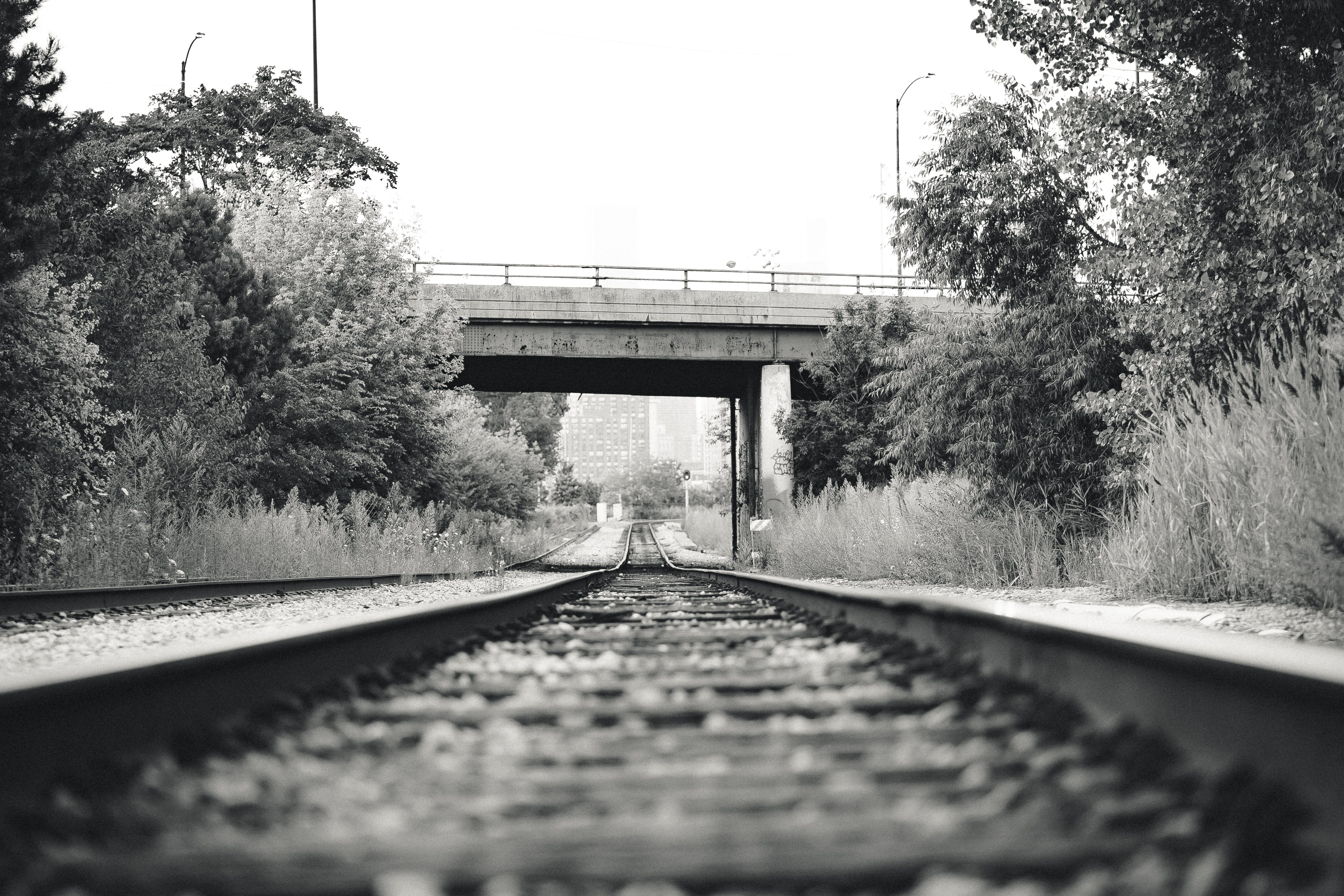 A black and white photo of a train track · Free Stock Photo