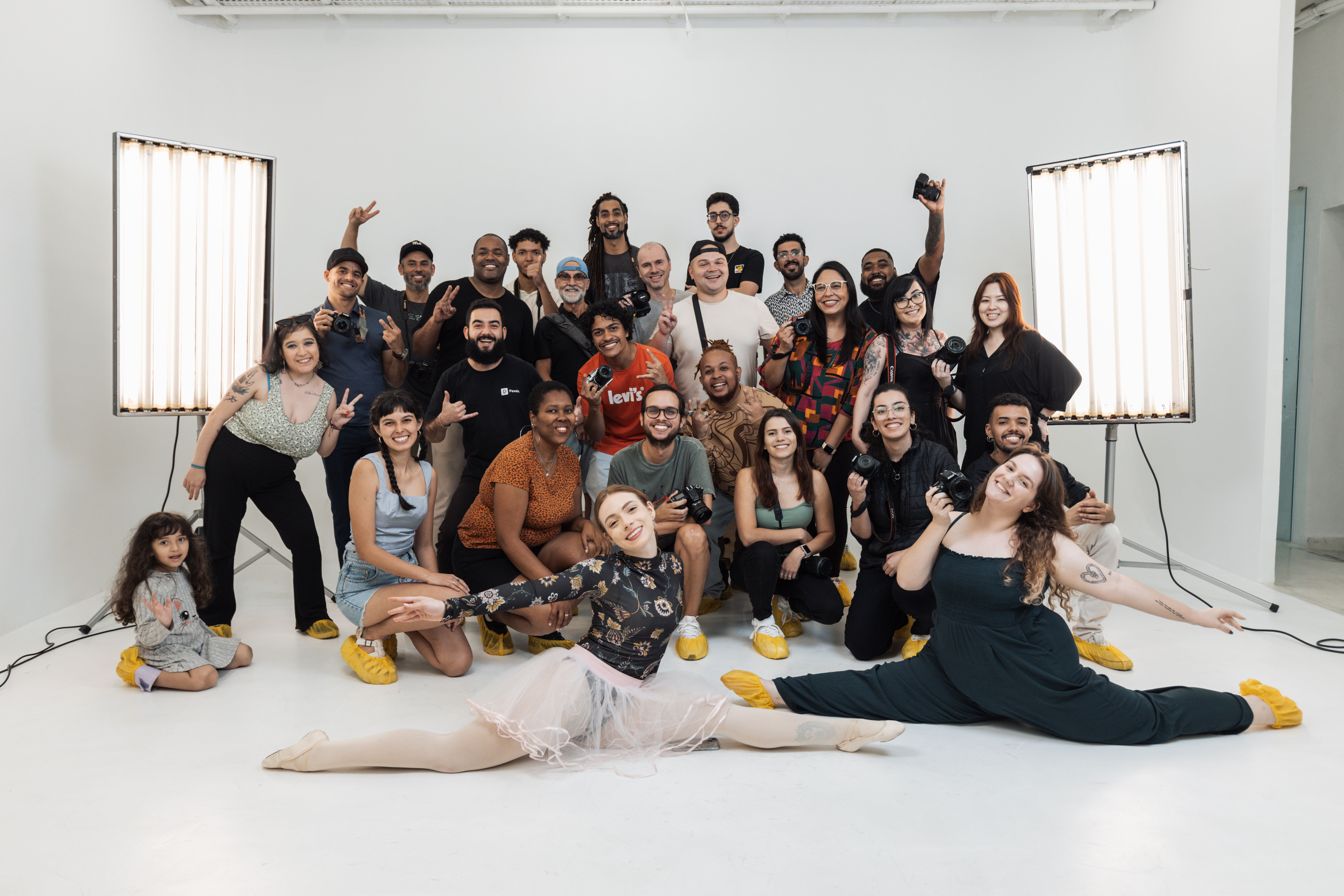A group of dancers posing for a photo in a studio · Free Stock Photo