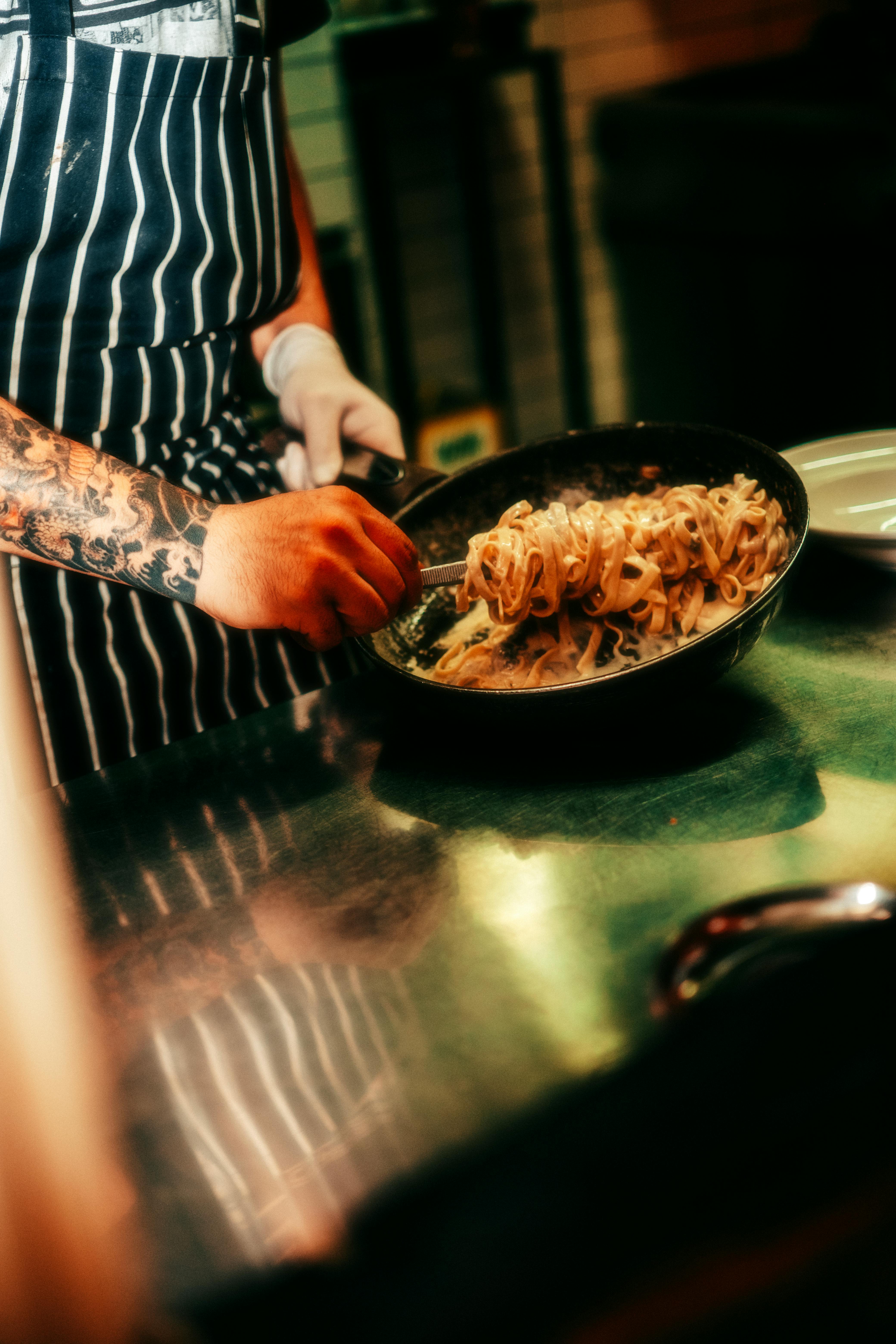 A Chef Busy Cooking · Free Stock Photo