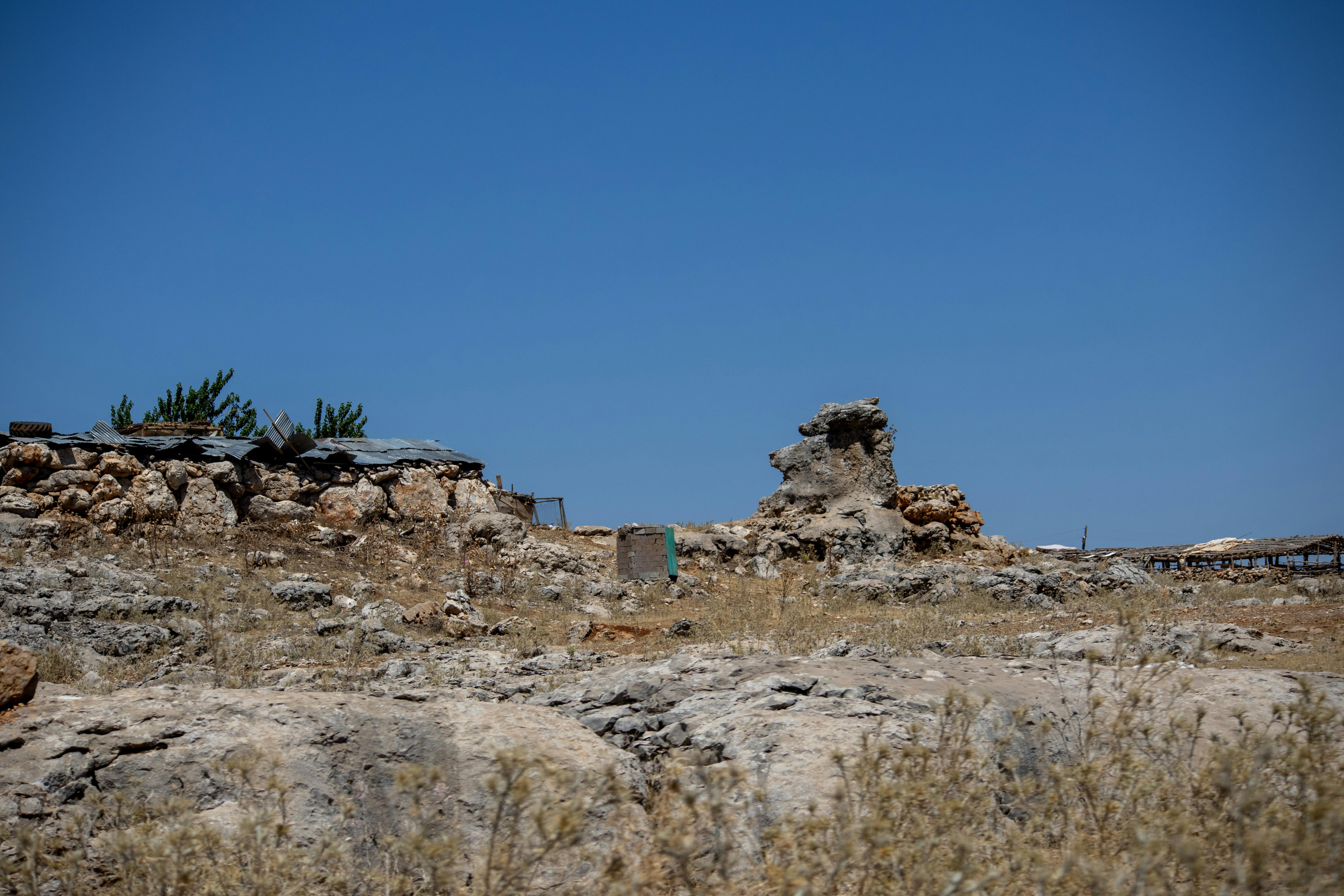 A small stone building with a stone roof · Free Stock Photo