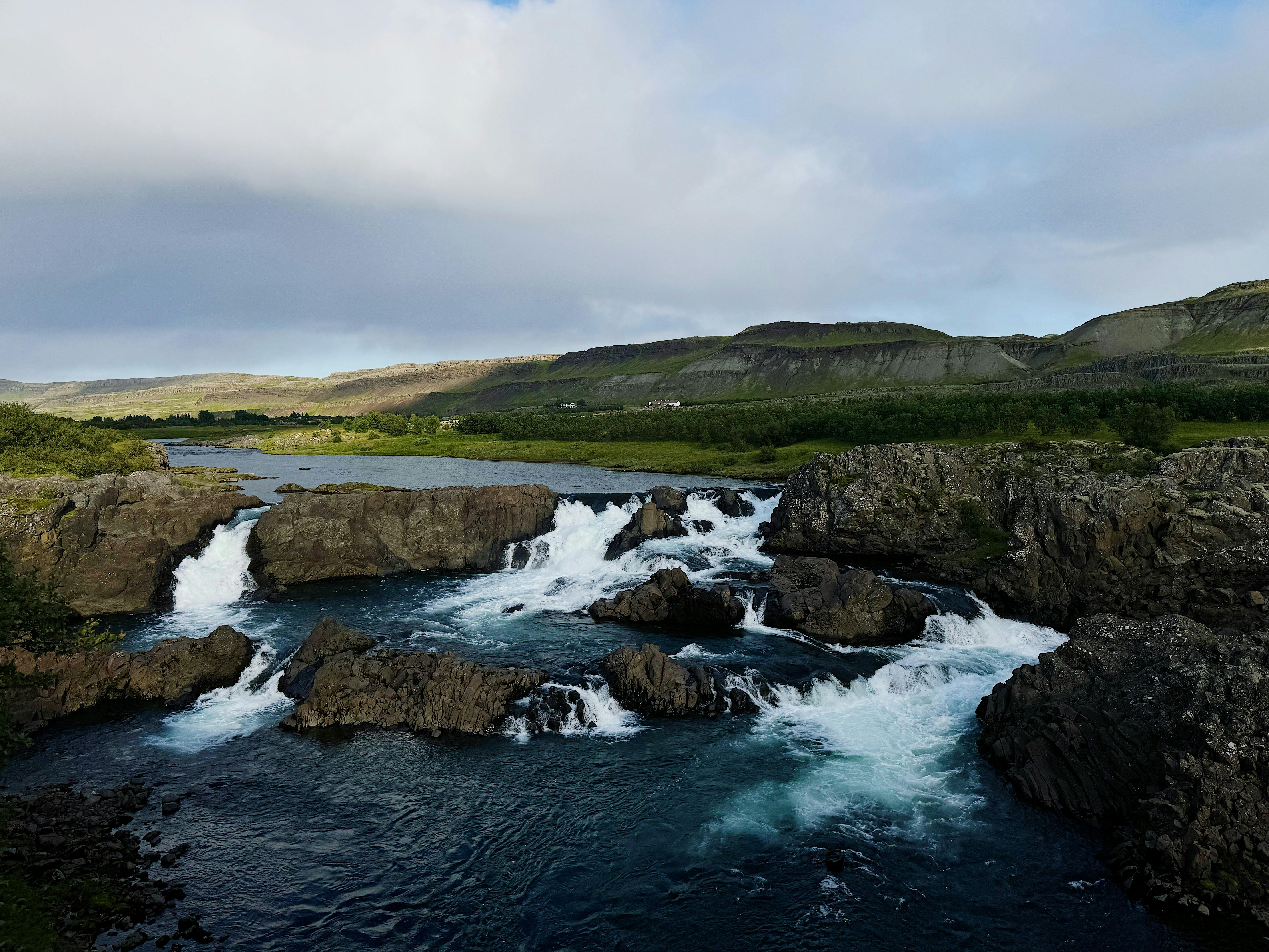 Photo of Waterfall Between Mountain · Free Stock Photo