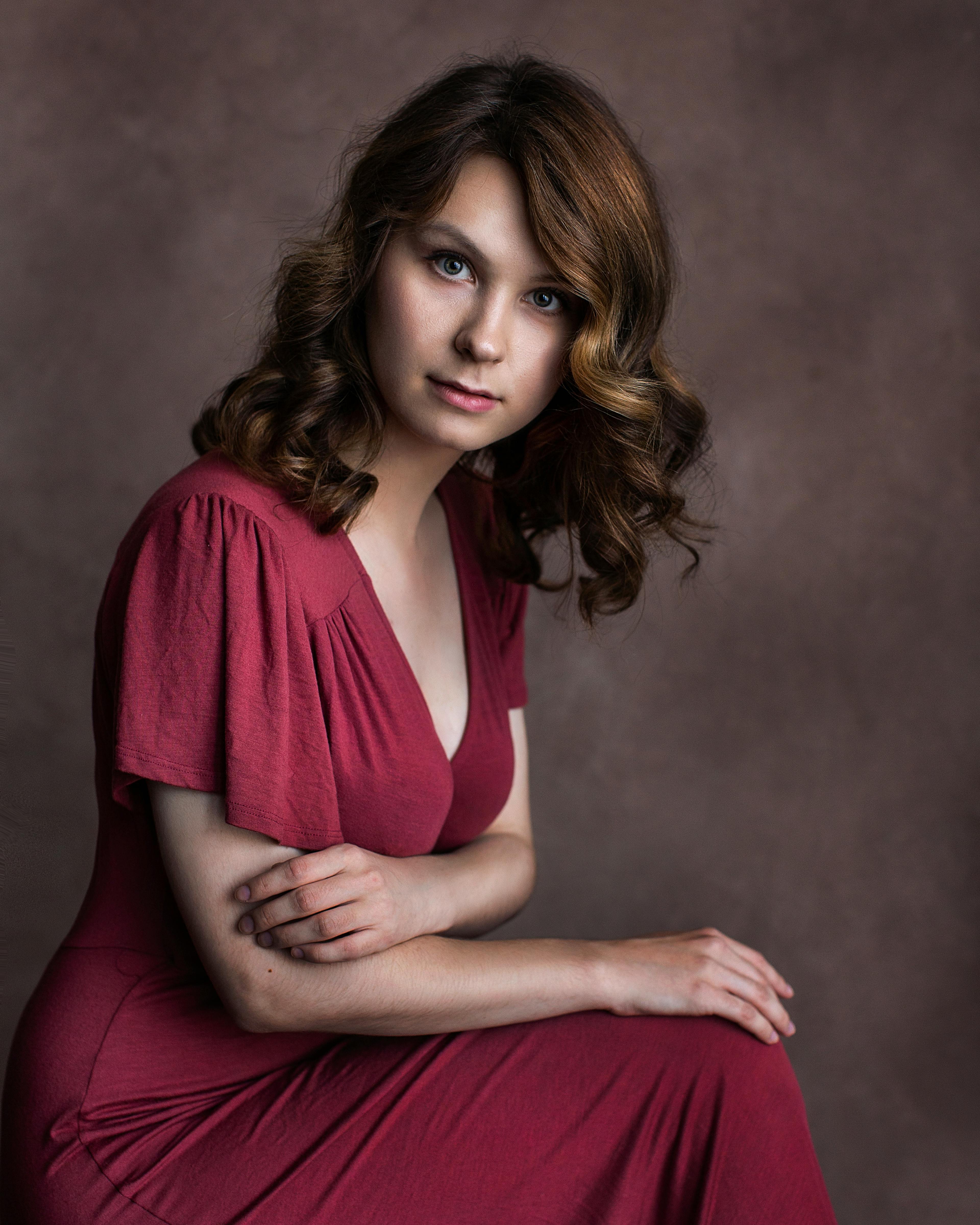 A Pretty Woman in Red Dress Sitting · Free Stock Photo