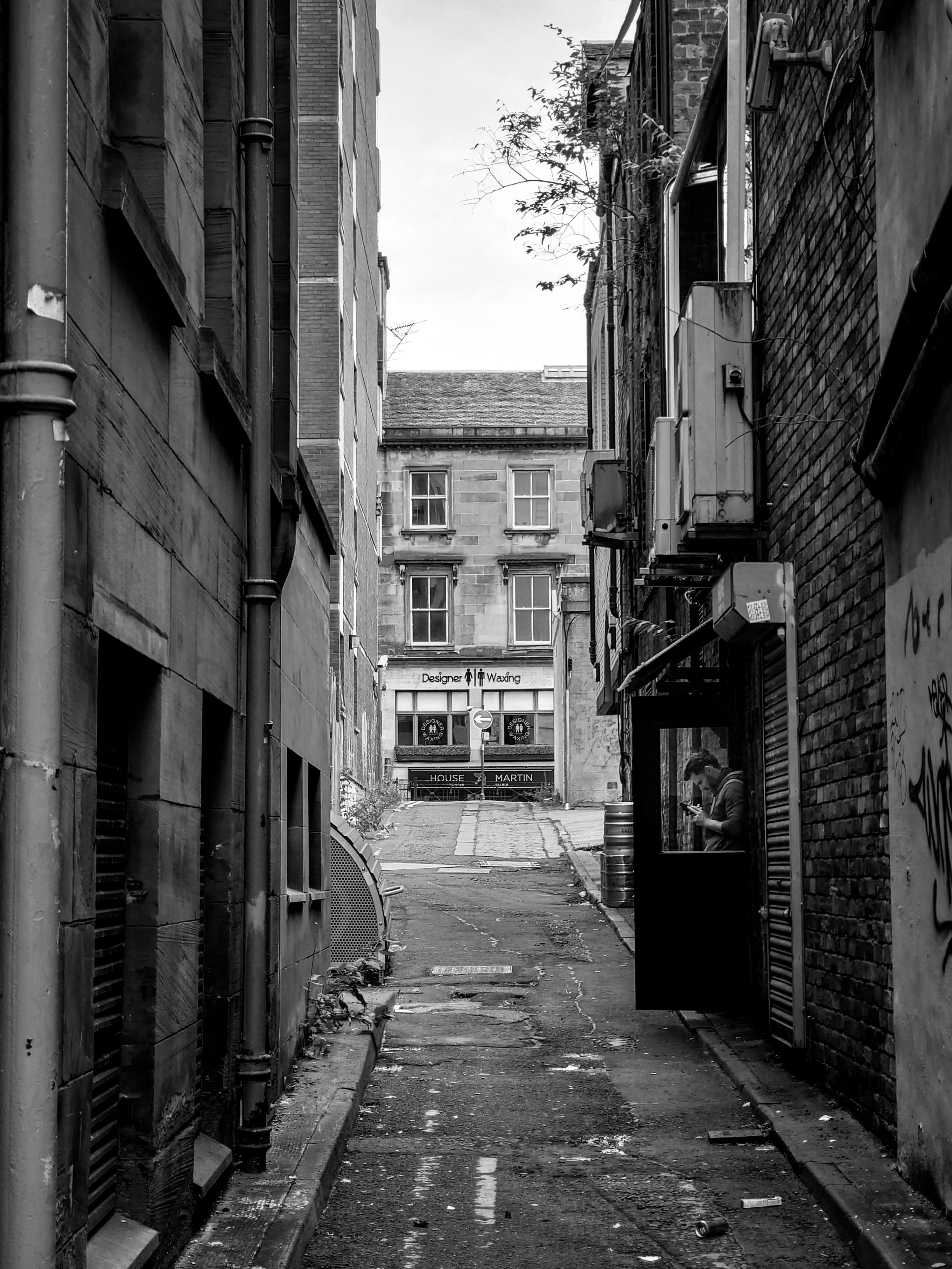Black and white photograph of a narrow alley · Free Stock Photo