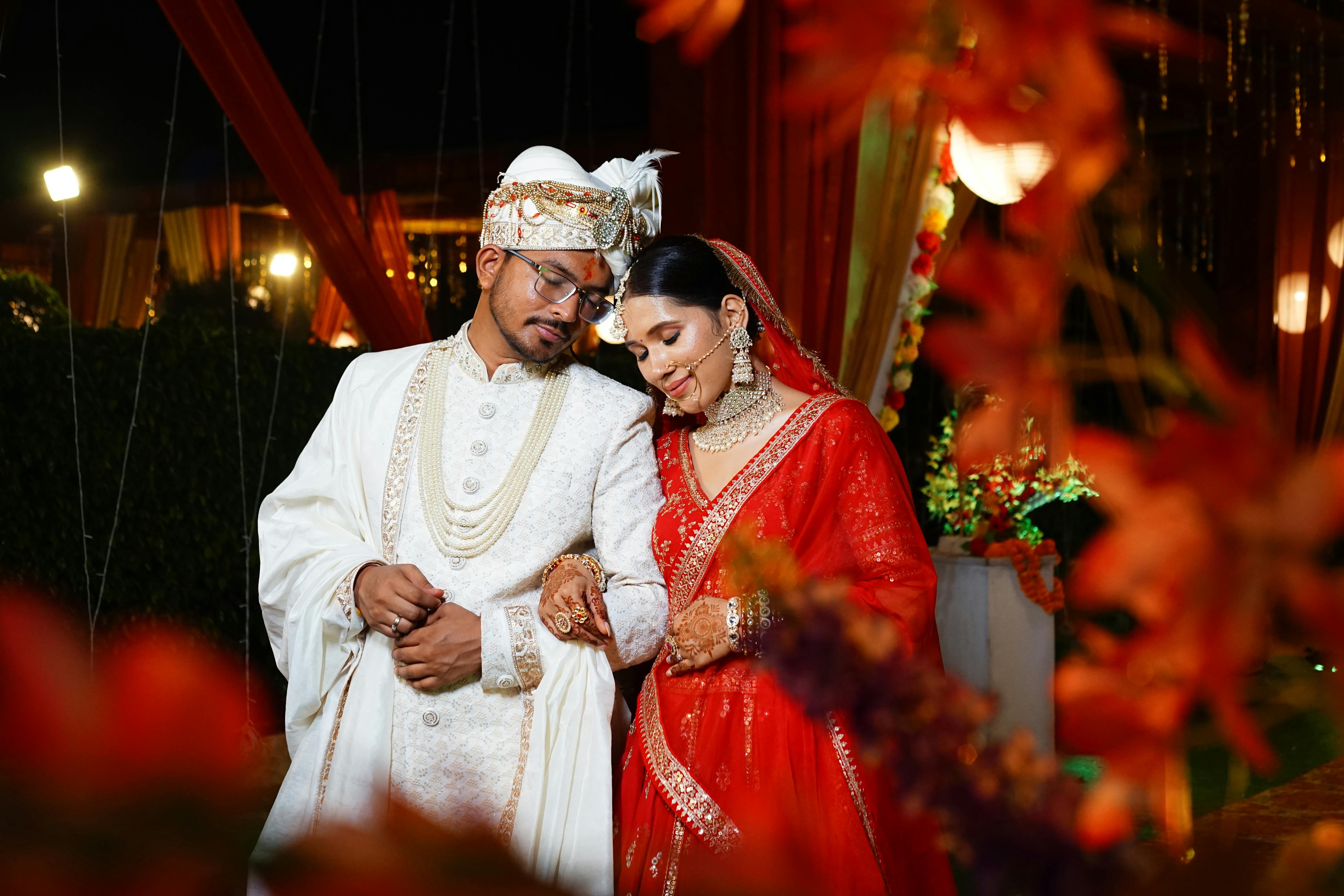 A bride and groom in traditional indian attire · Free Stock Photo
