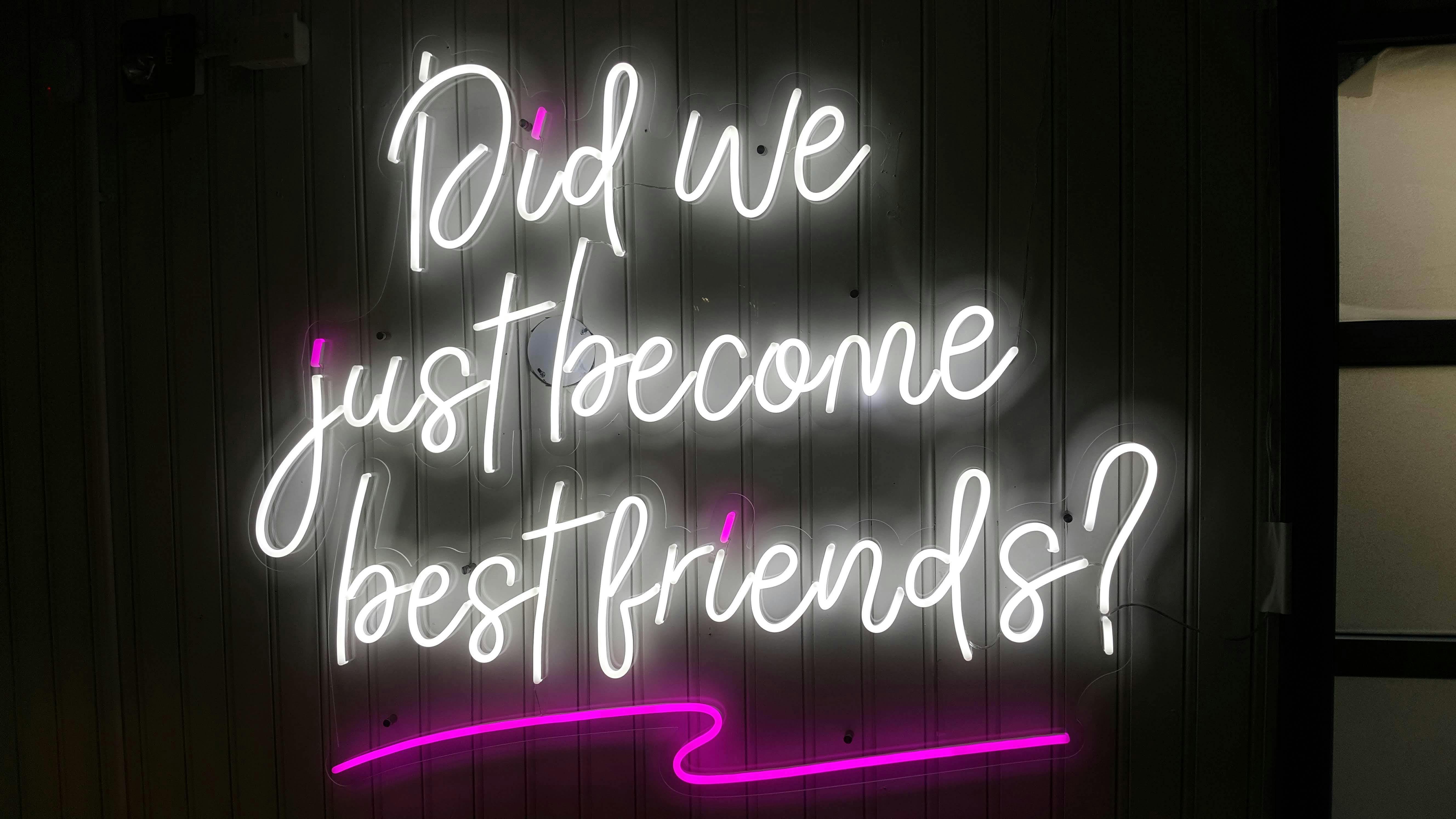 A neon sign that says did we just become best friends? · Free Stock Photo