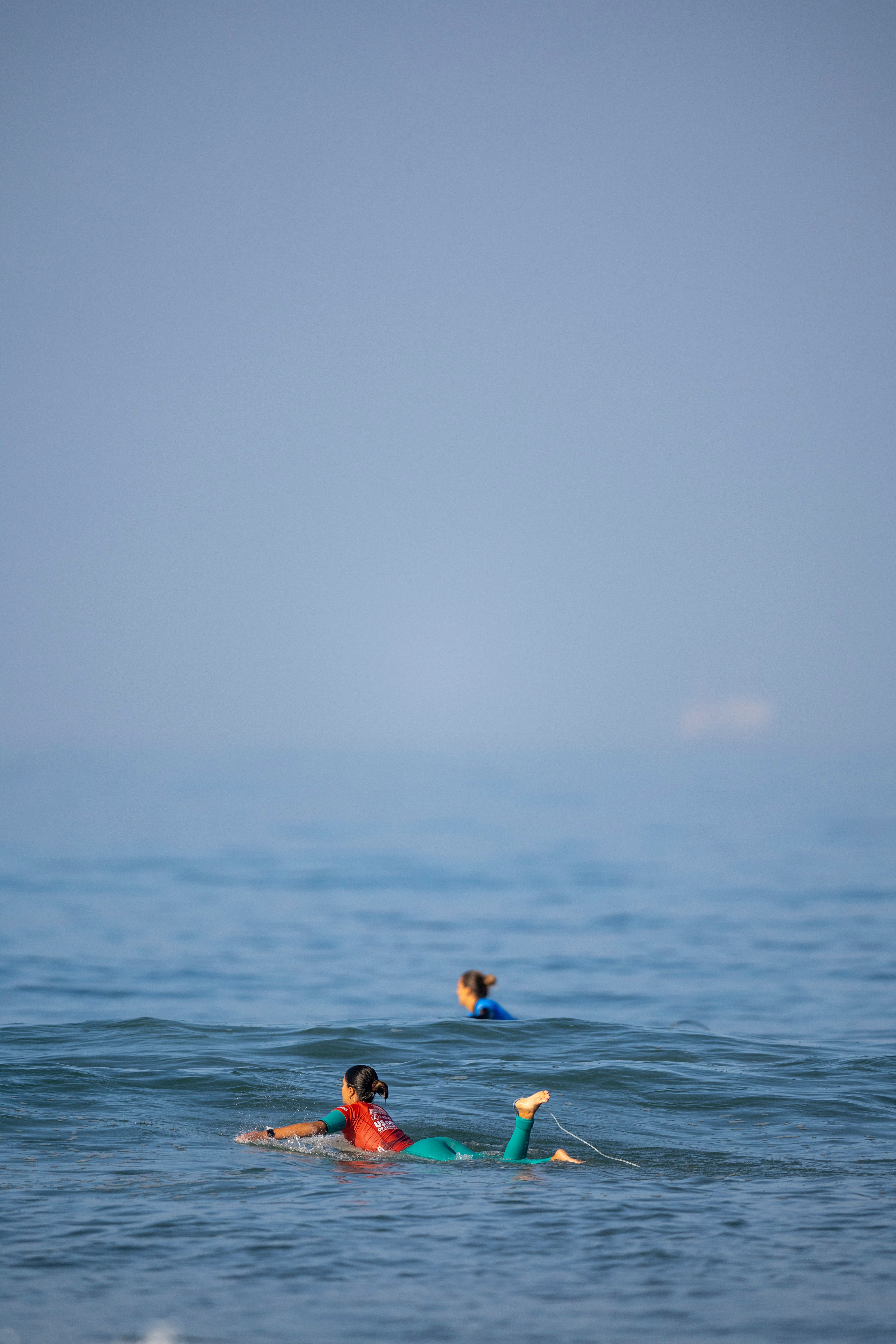 A group of people in the ocean with surfboards · Free Stock Photo