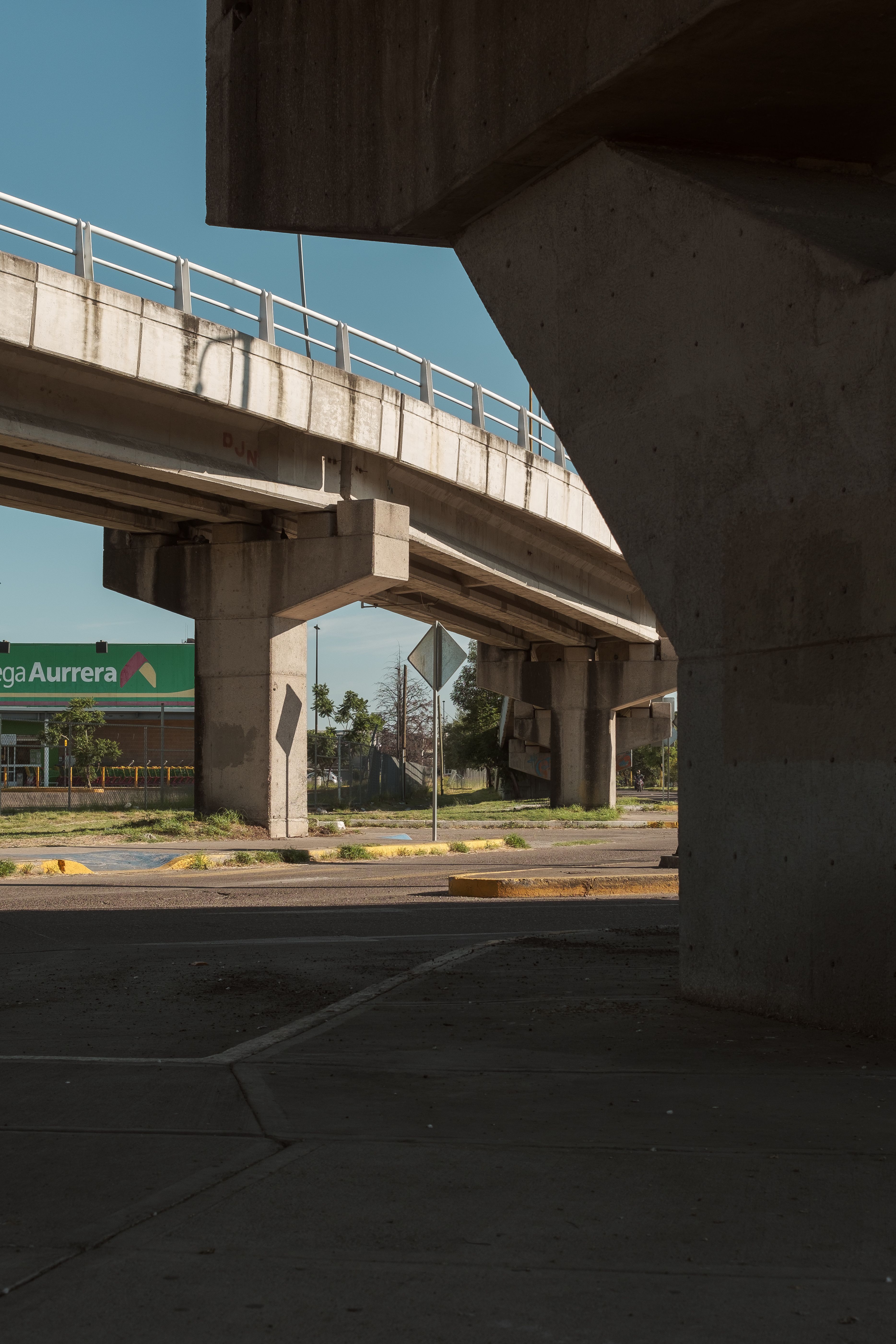 A view of a highway underpass with a car driving under it · Free Stock ...