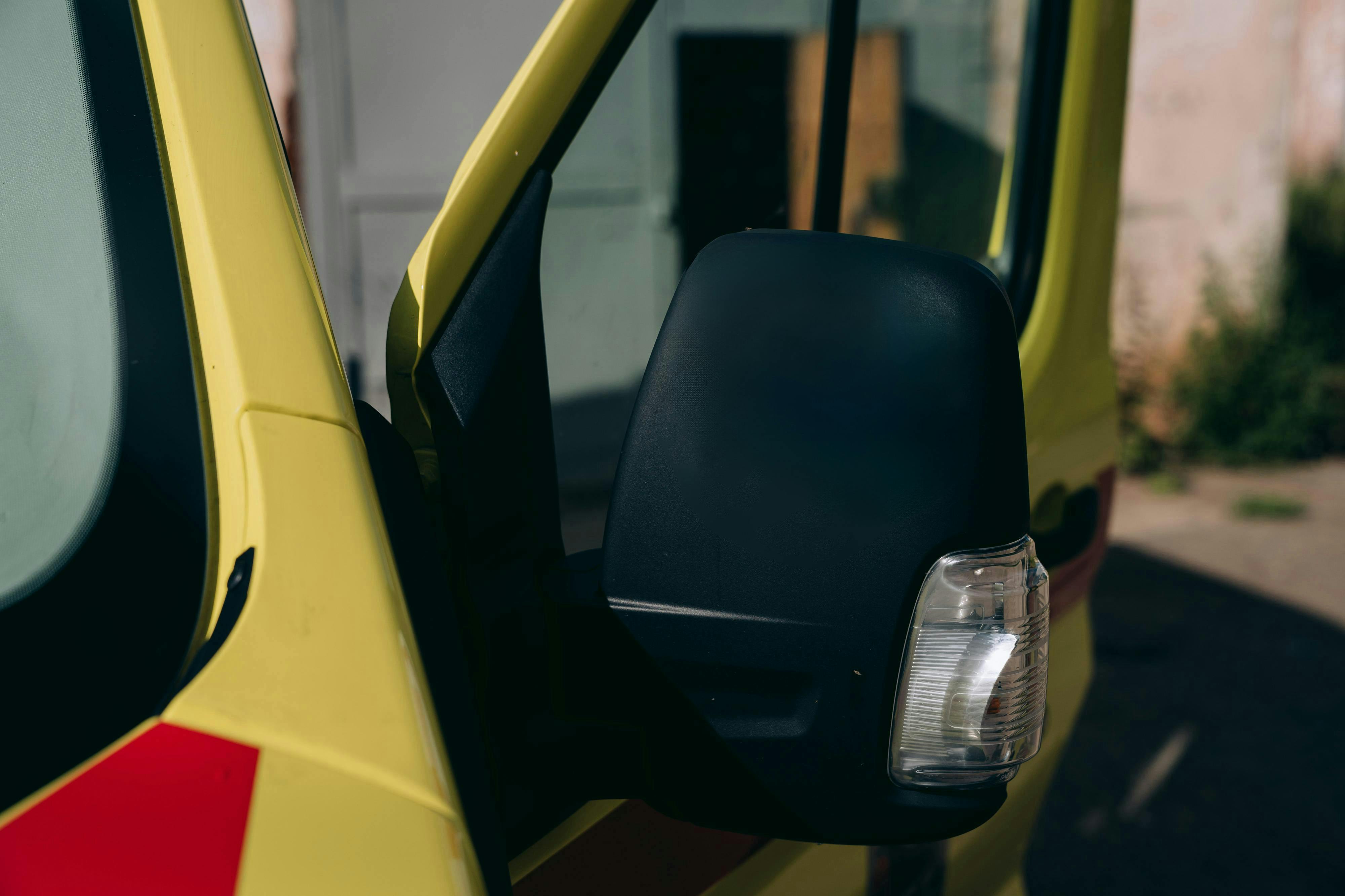 Side Mirror with Turn Signal of the Ambulance · Free Stock Photo