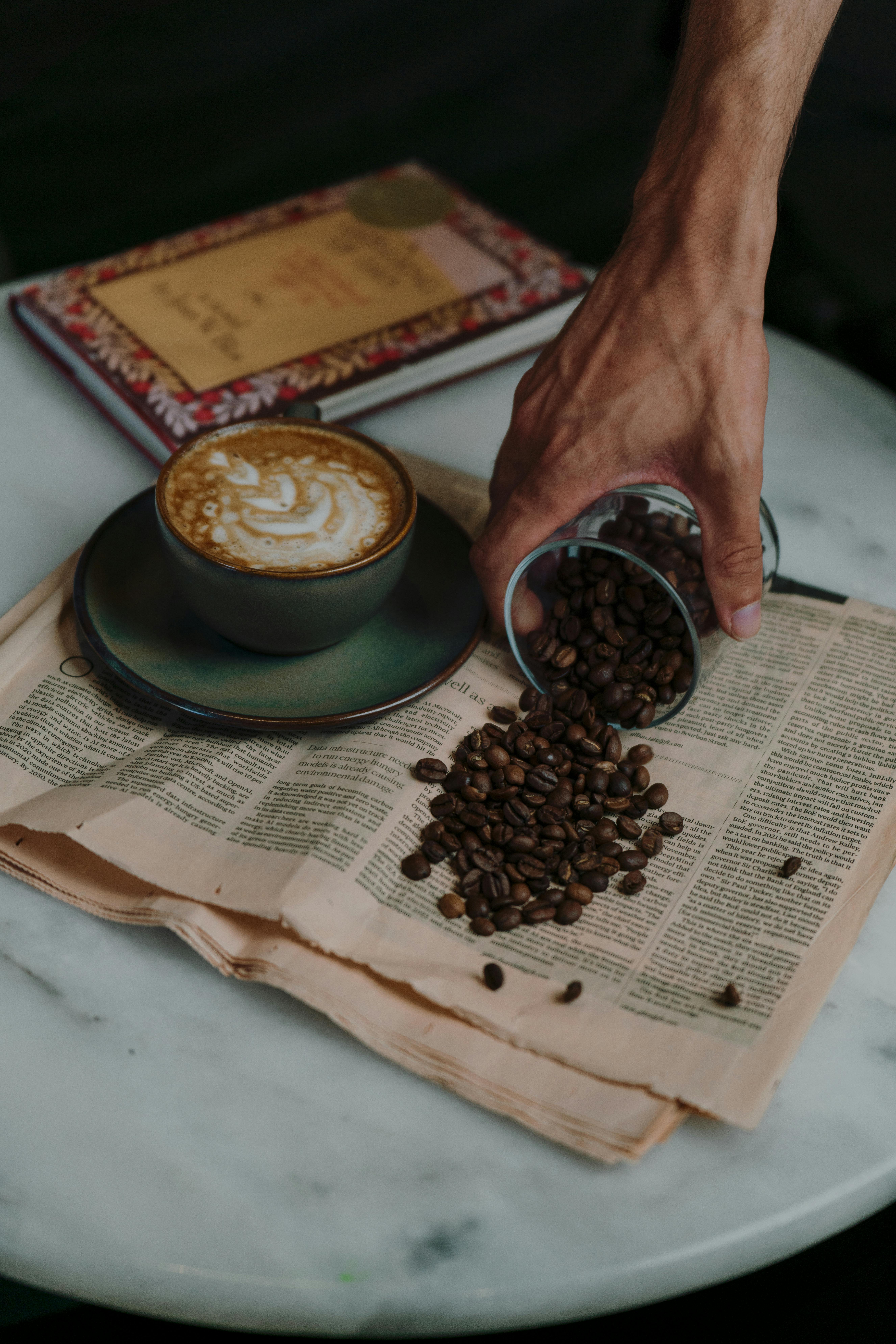 Coffee Beans on a Newspaper · Free Stock Photo