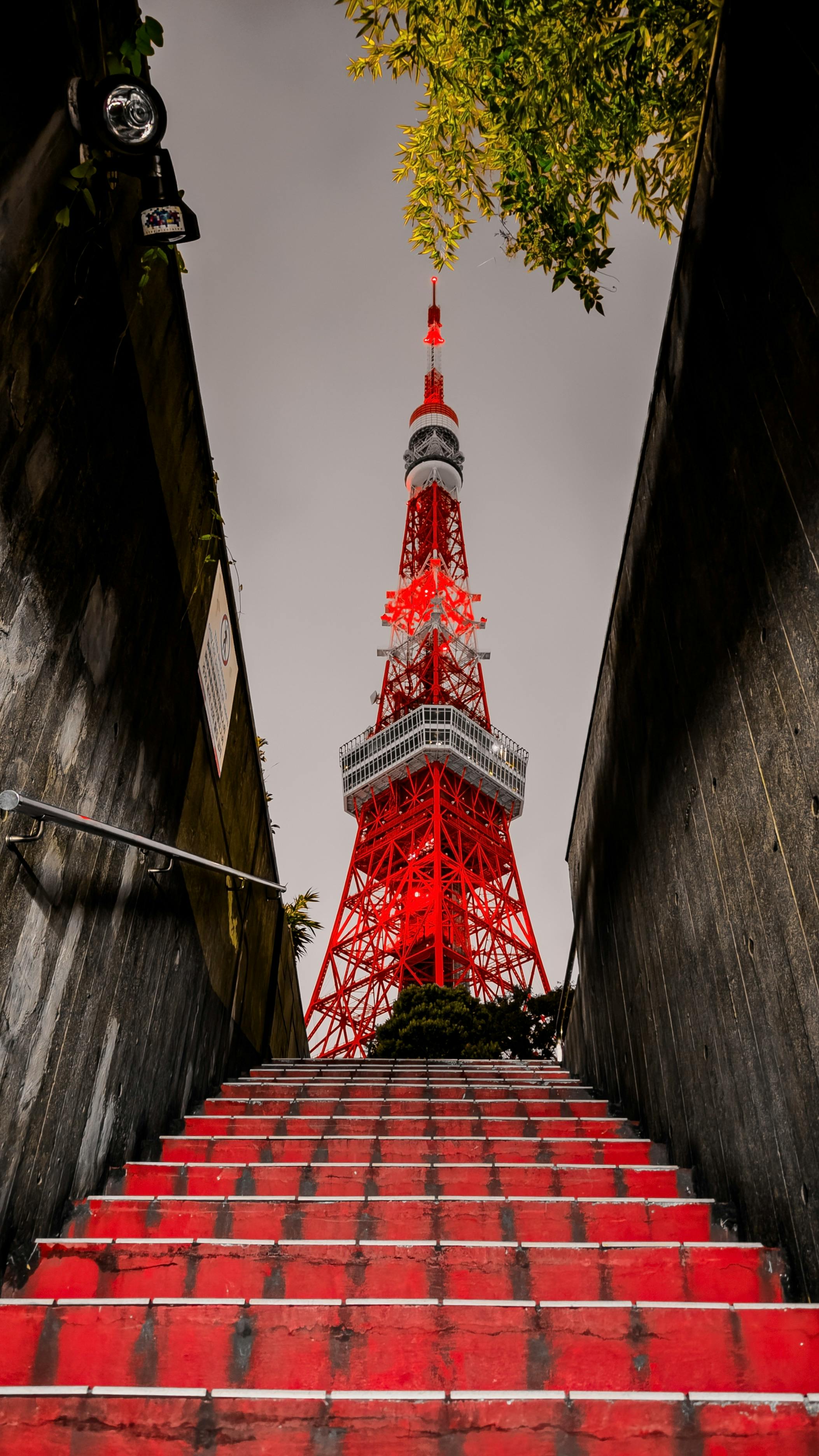A red stairs leading up to a tower · Free Stock Photo