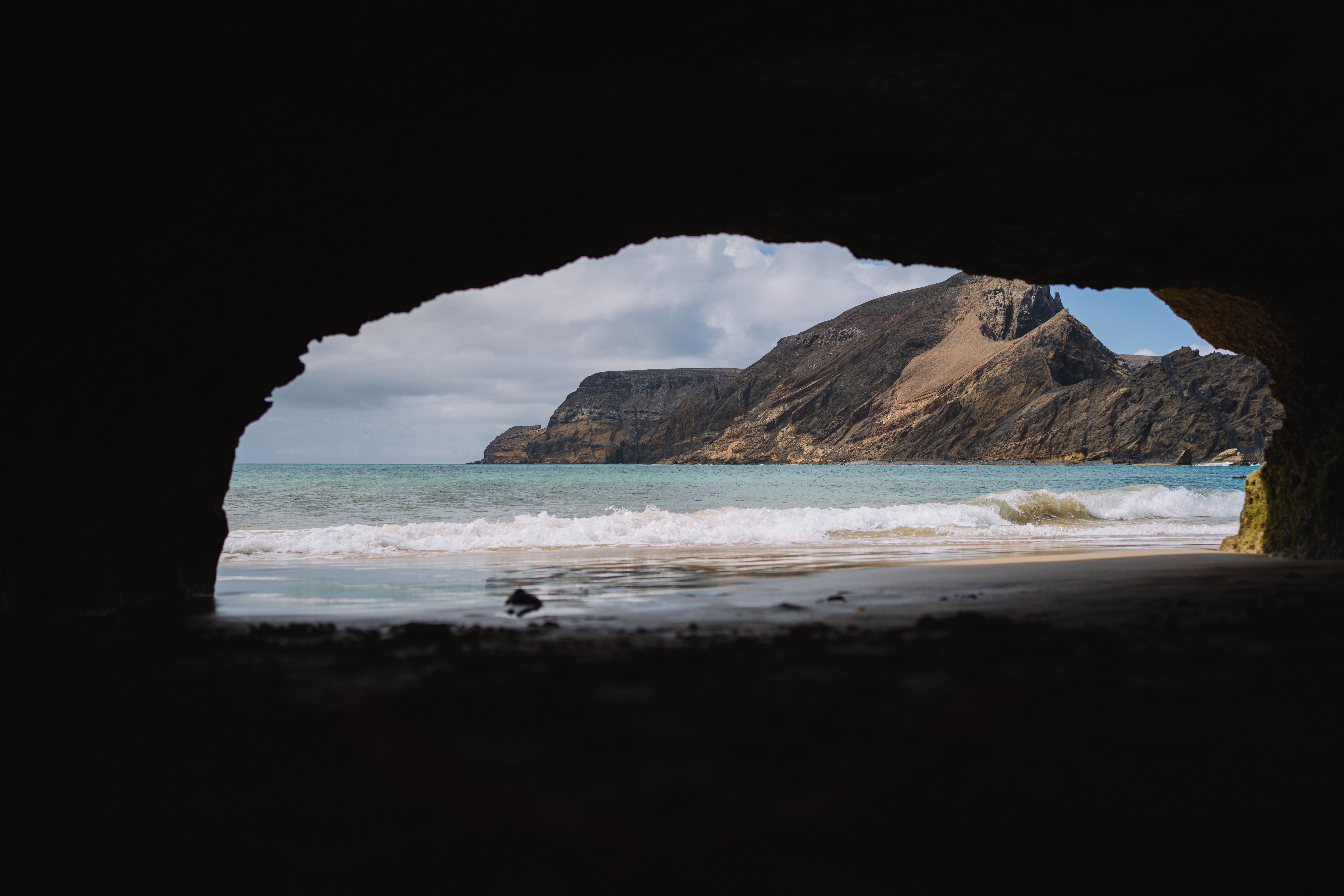 A view of the ocean from inside a cave · Free Stock Photo