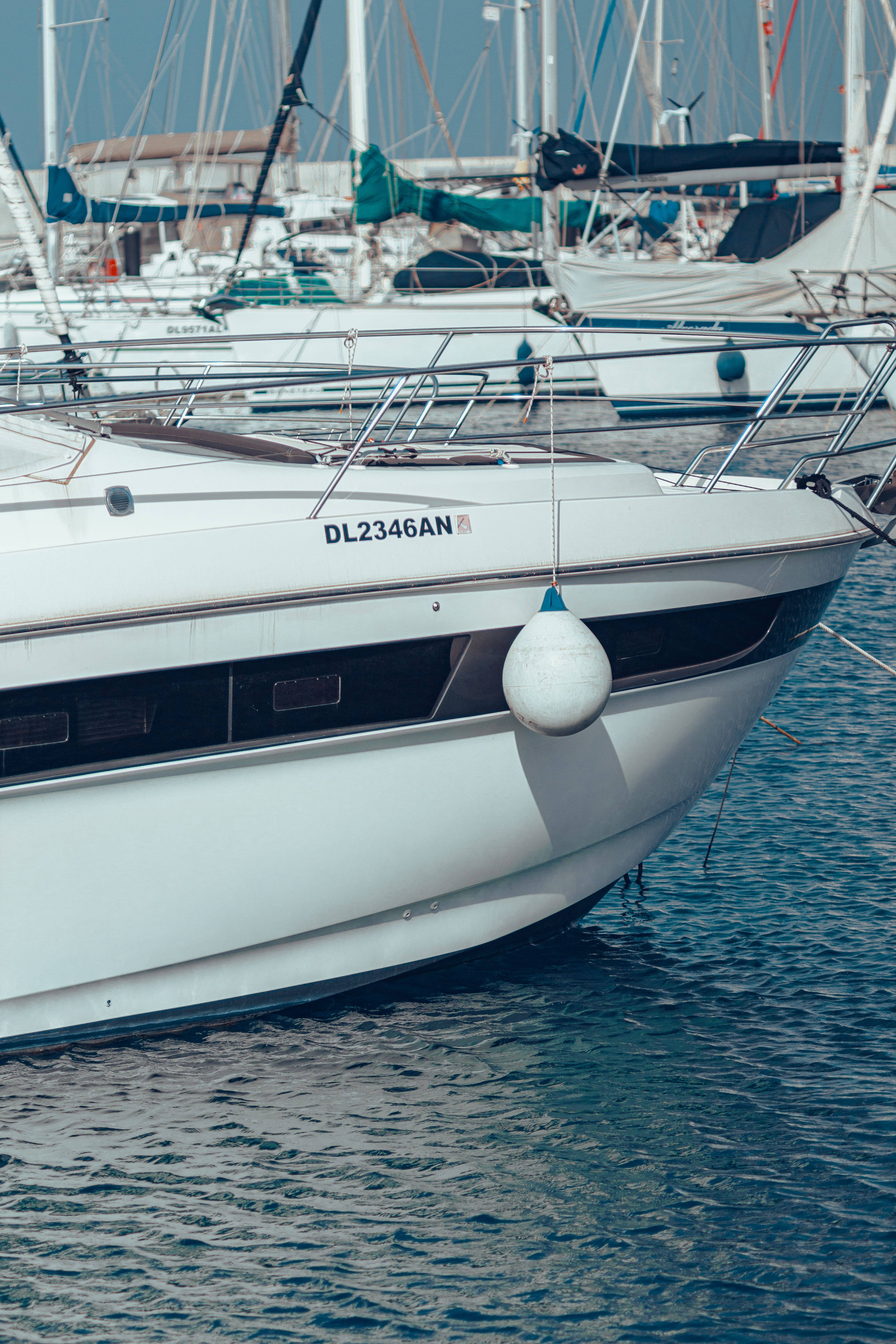A white boat docked at a marina · Free Stock Photo