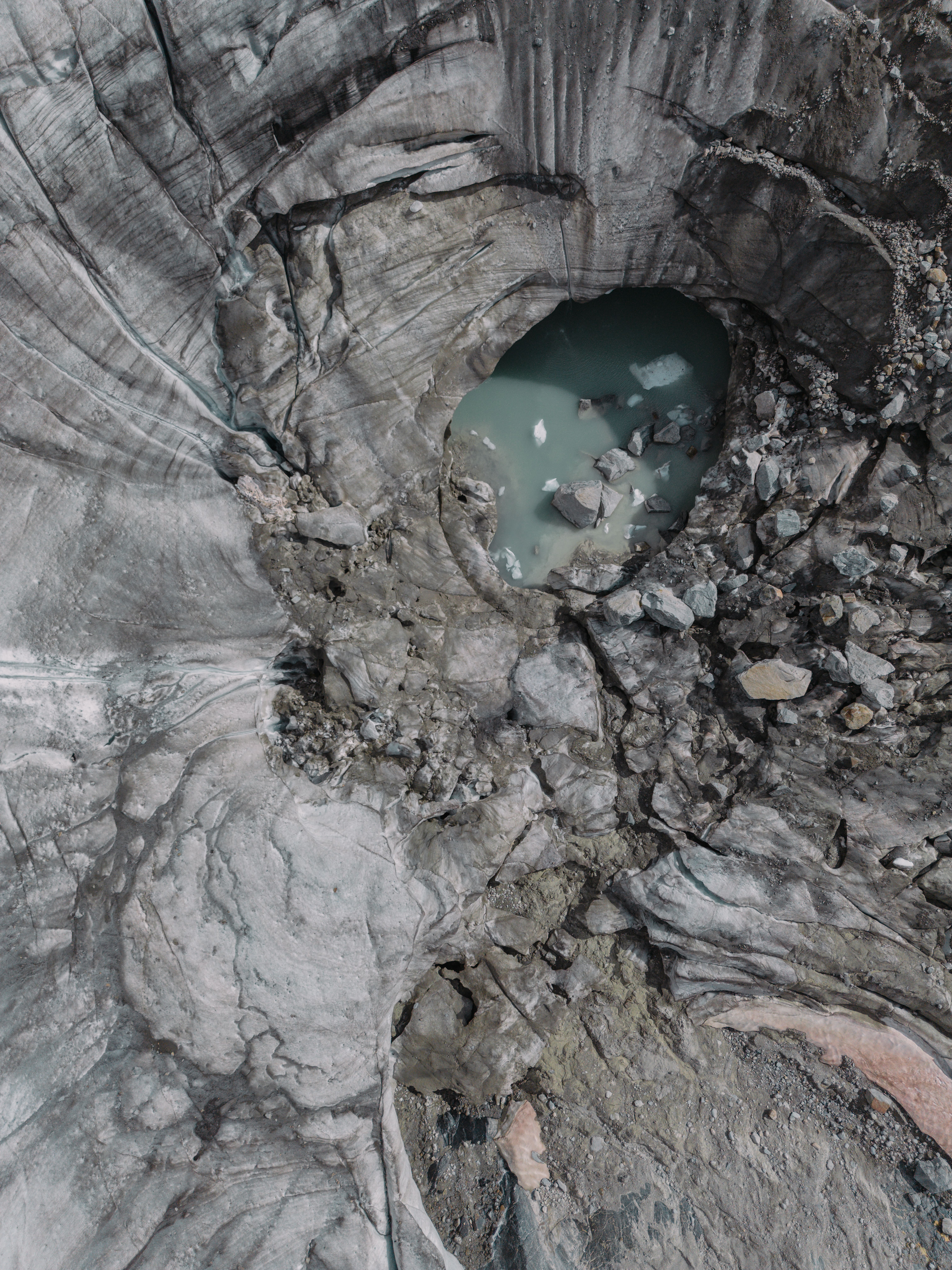 Barren Rocks around Pond in Cave · Free Stock Photo