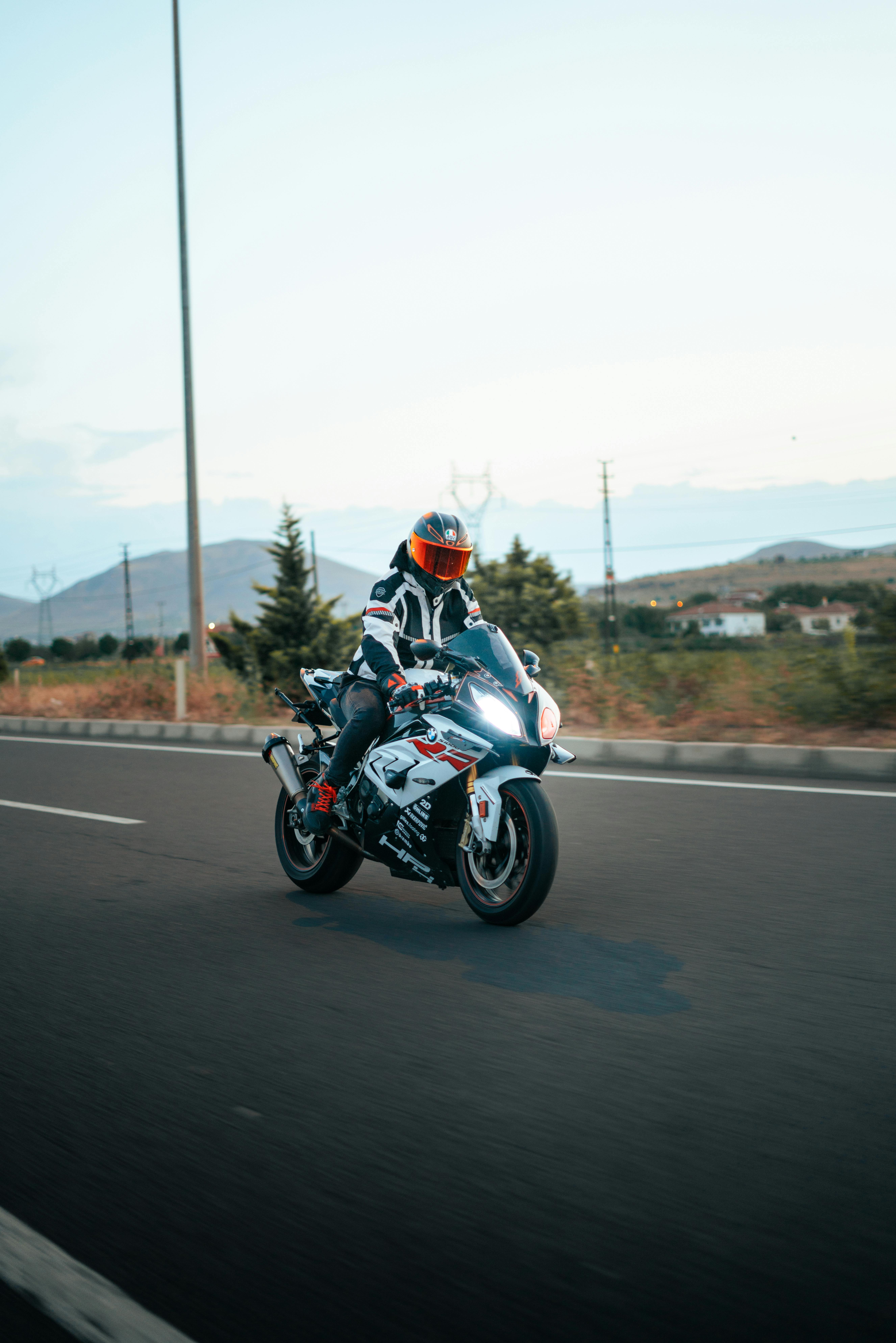 Person Riding Motorcycle during Golden Hour · Free Stock Photo