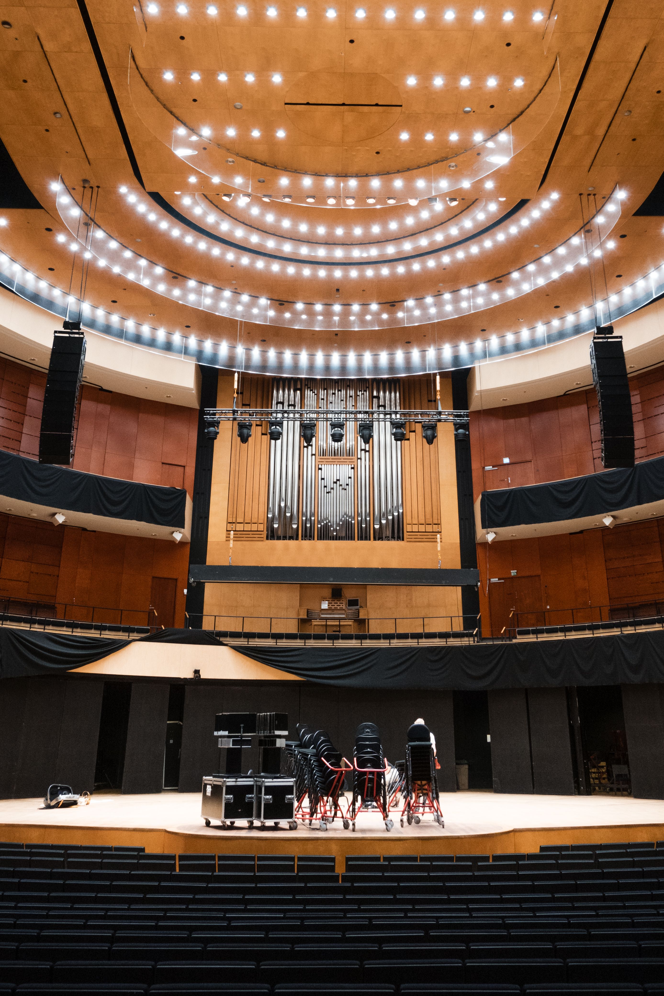 The inside of a large auditorium with a large stage · Free Stock Photo