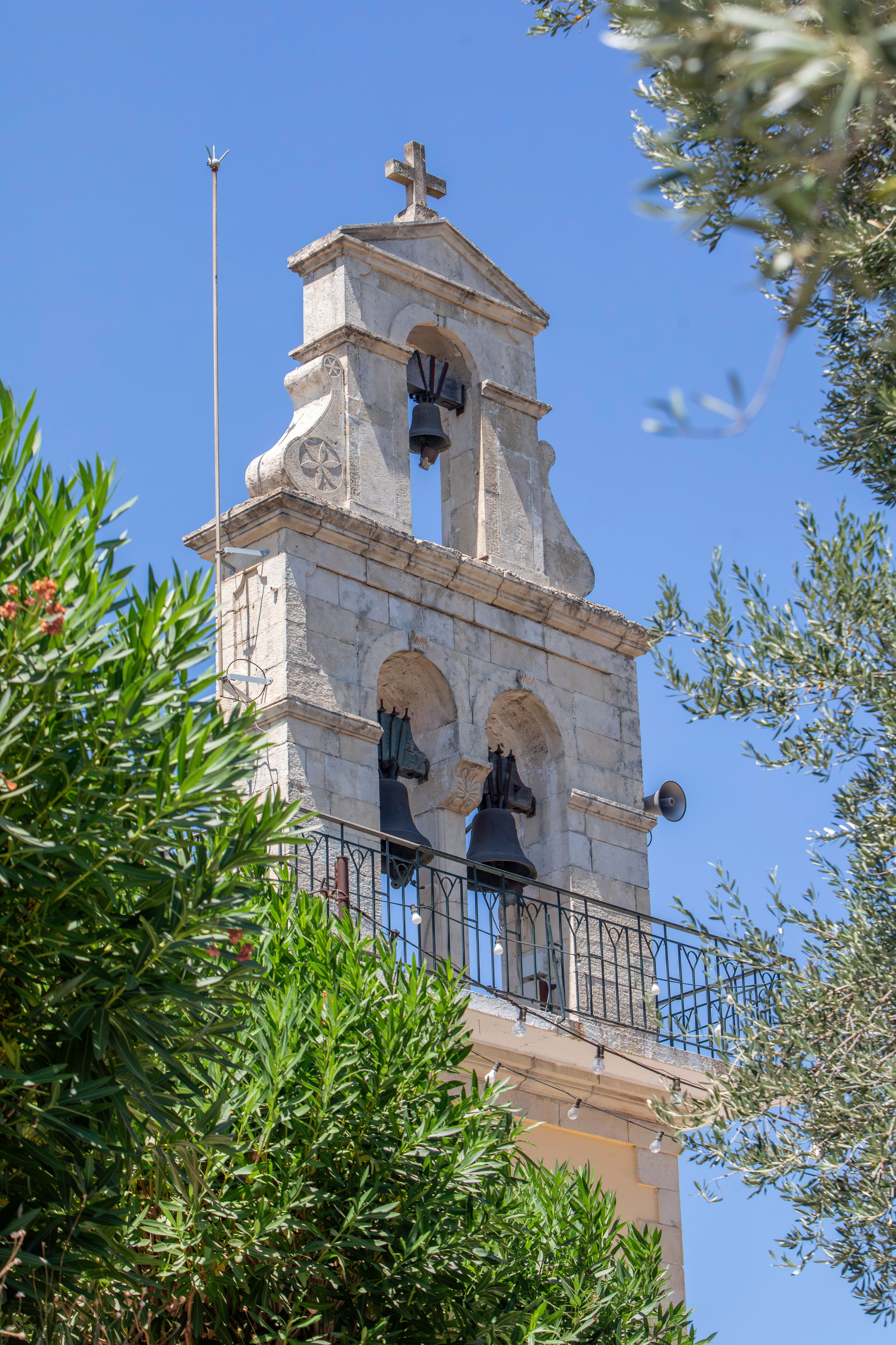 A bell tower with a bell on top · Free Stock Photo