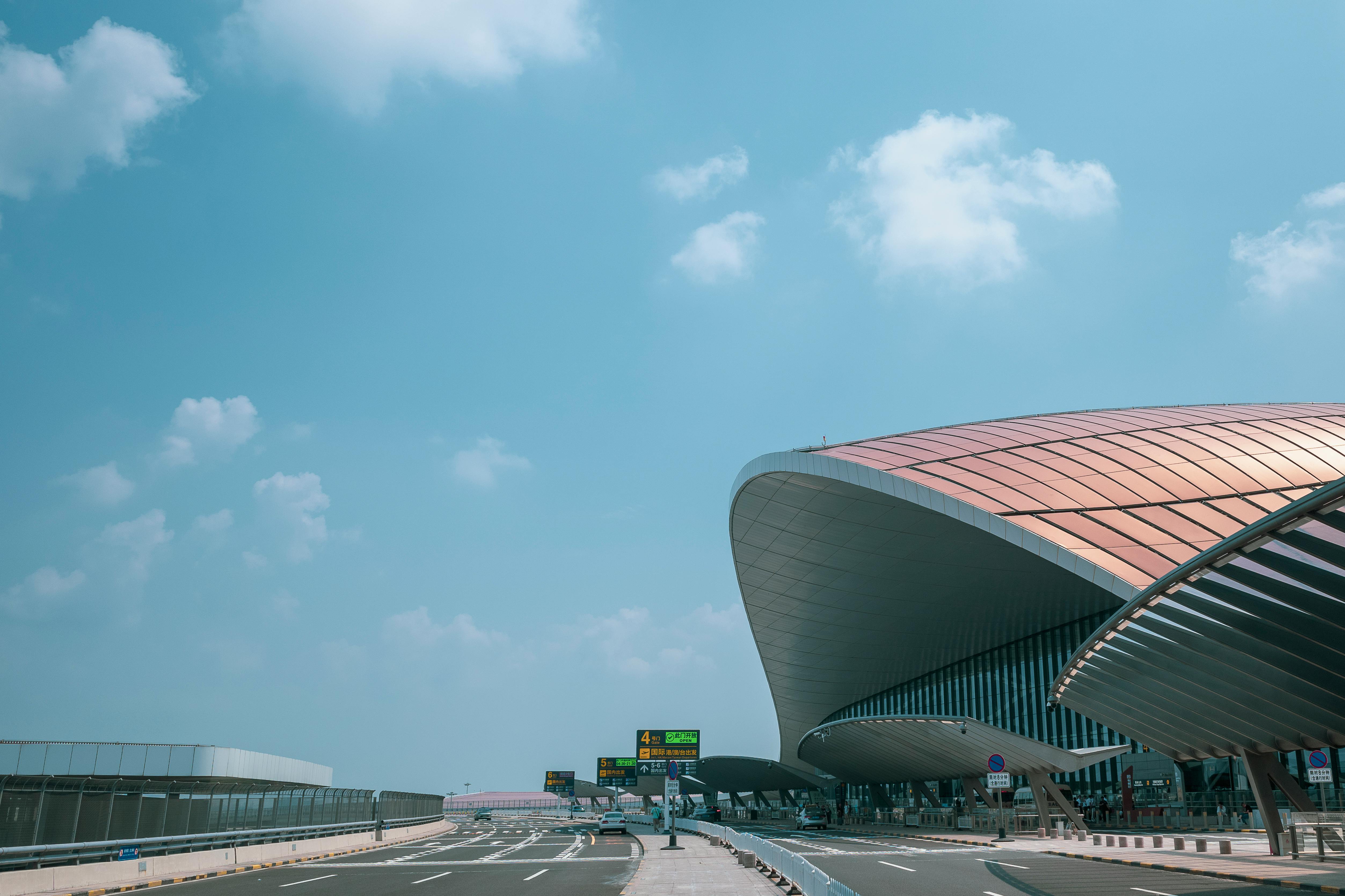 A large building with a large roof and a large curved roof · Free Stock ...