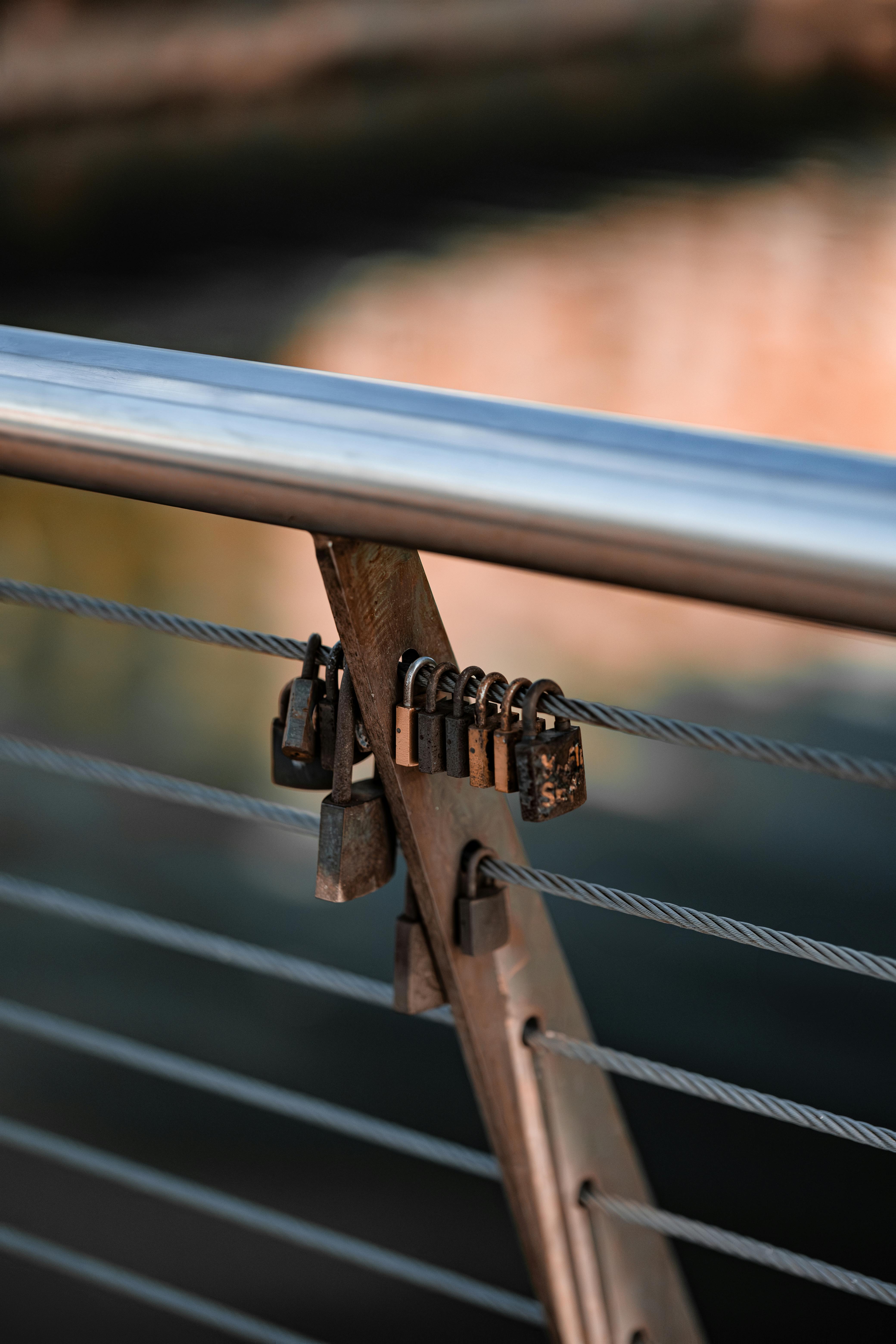 A metal railing with a lock on it · Free Stock Photo