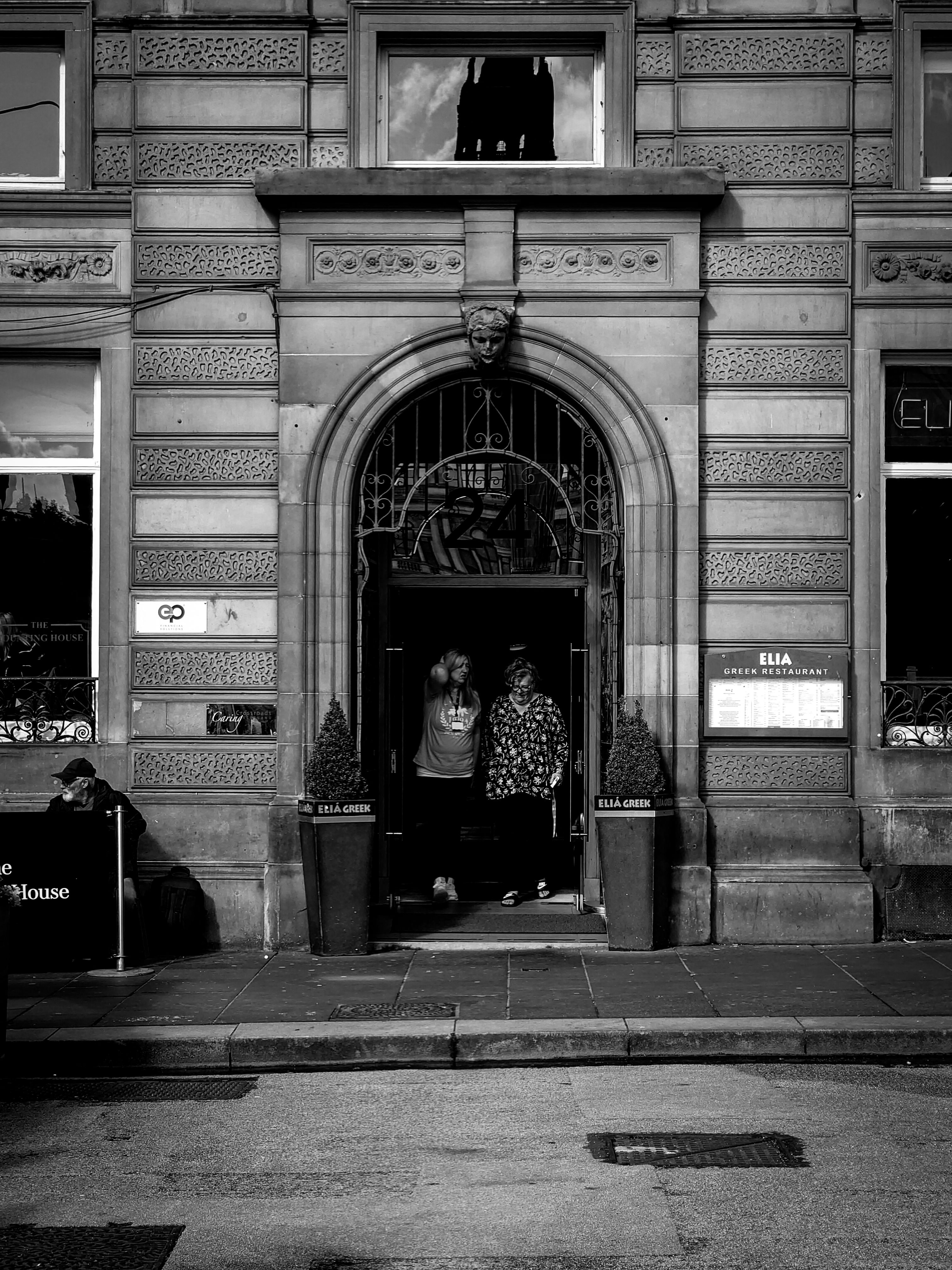 Black and white photo of two people standing outside a building · Free ...