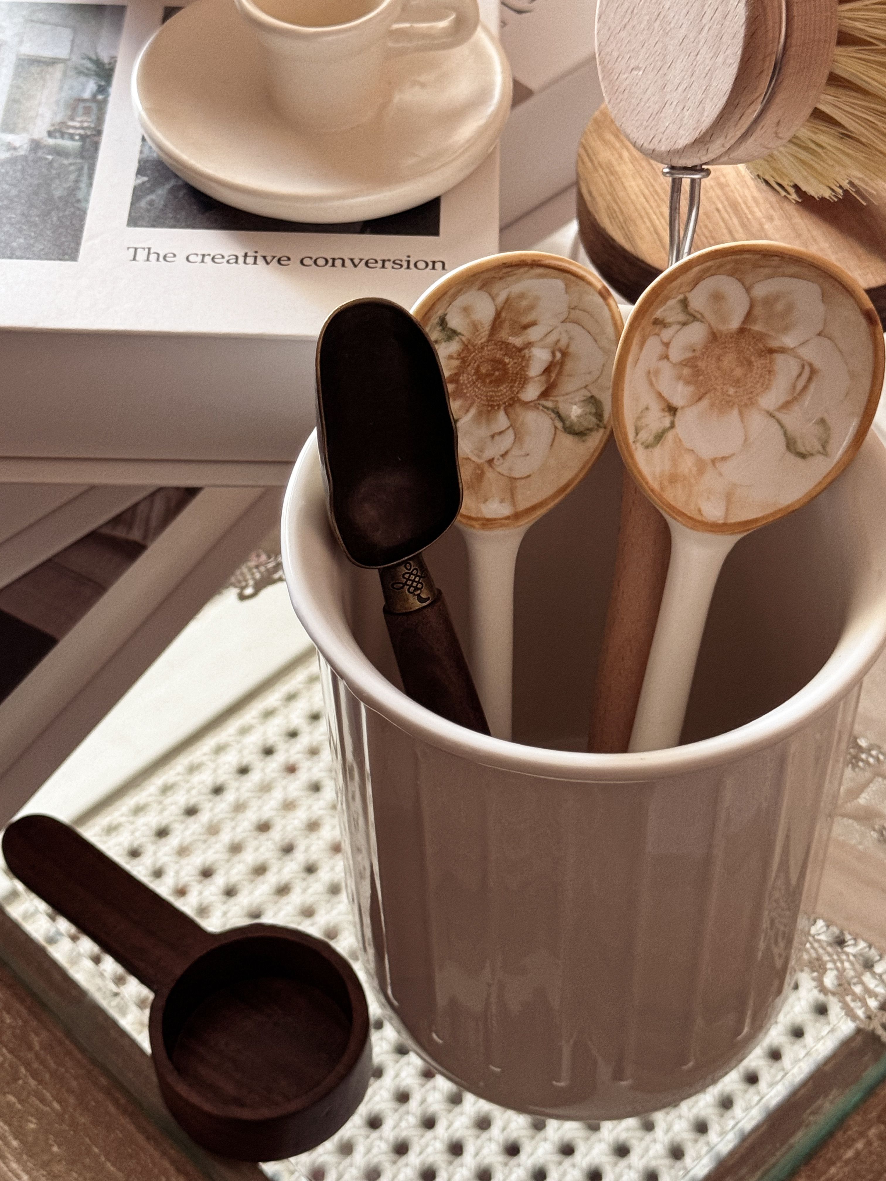 A cup with a spoon and a spoon holder on top · Free Stock Photo