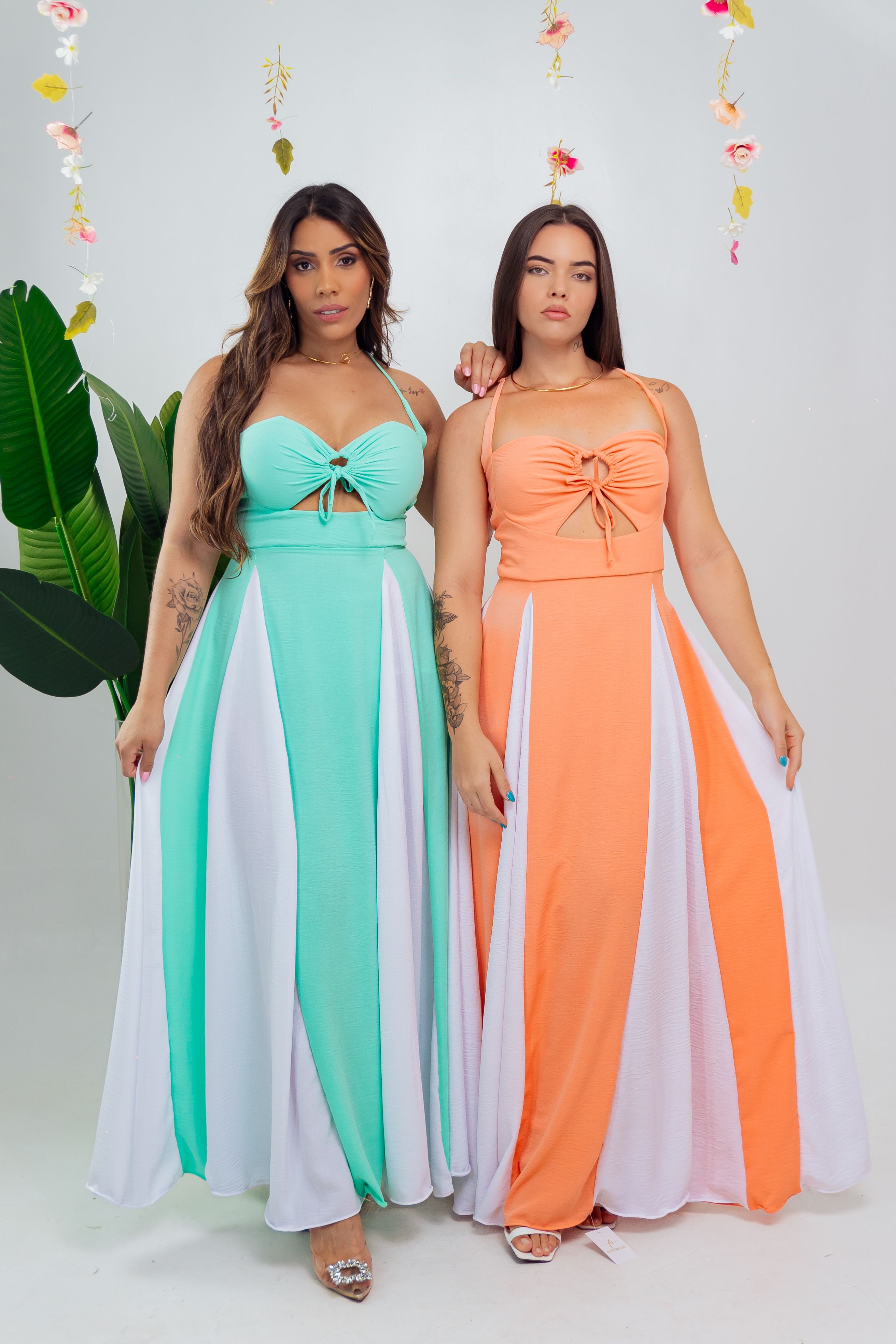 Two women in colorful dresses standing next to each other · Free Stock ...