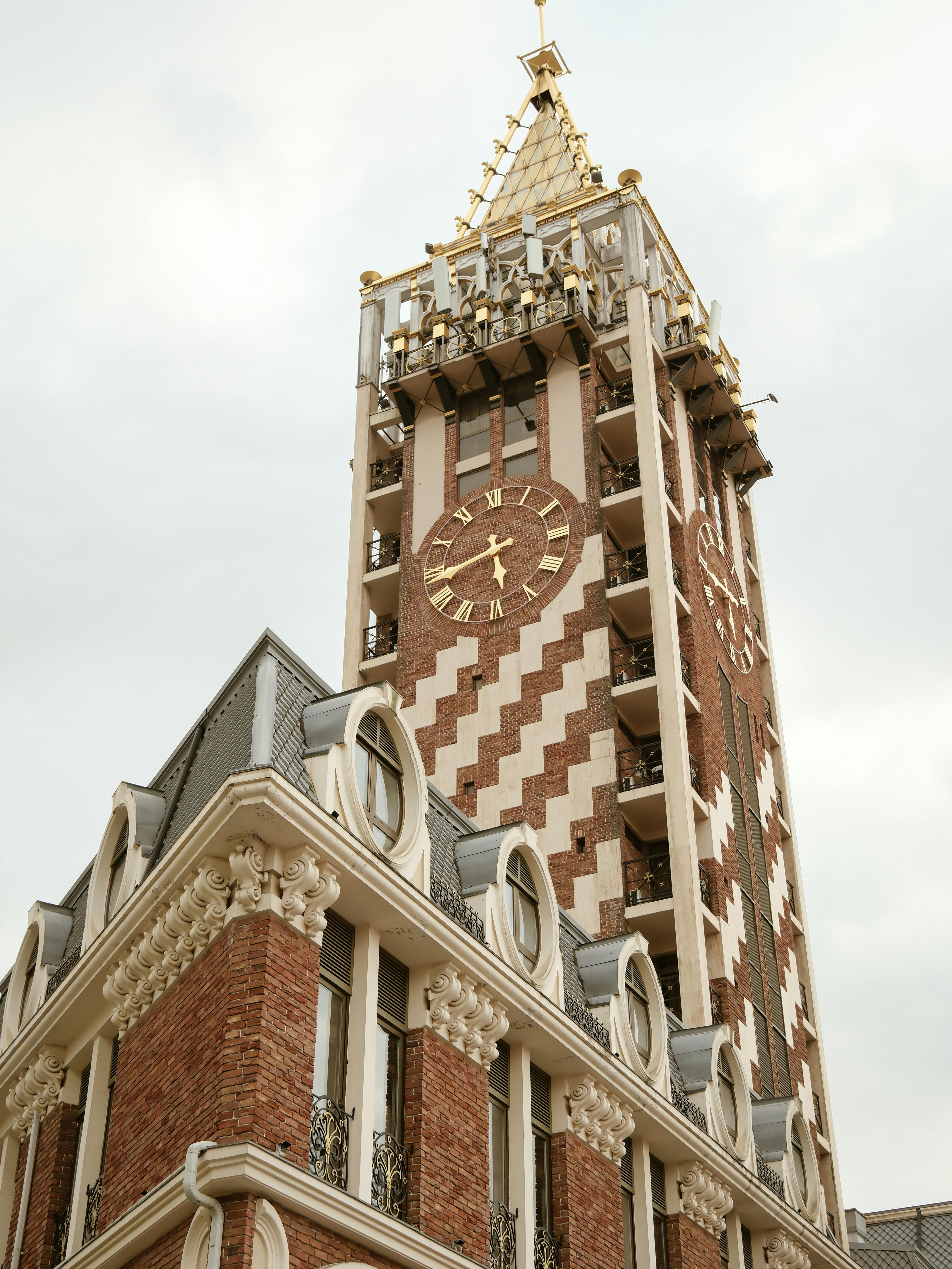 A large clock tower with a clock on it · Free Stock Photo