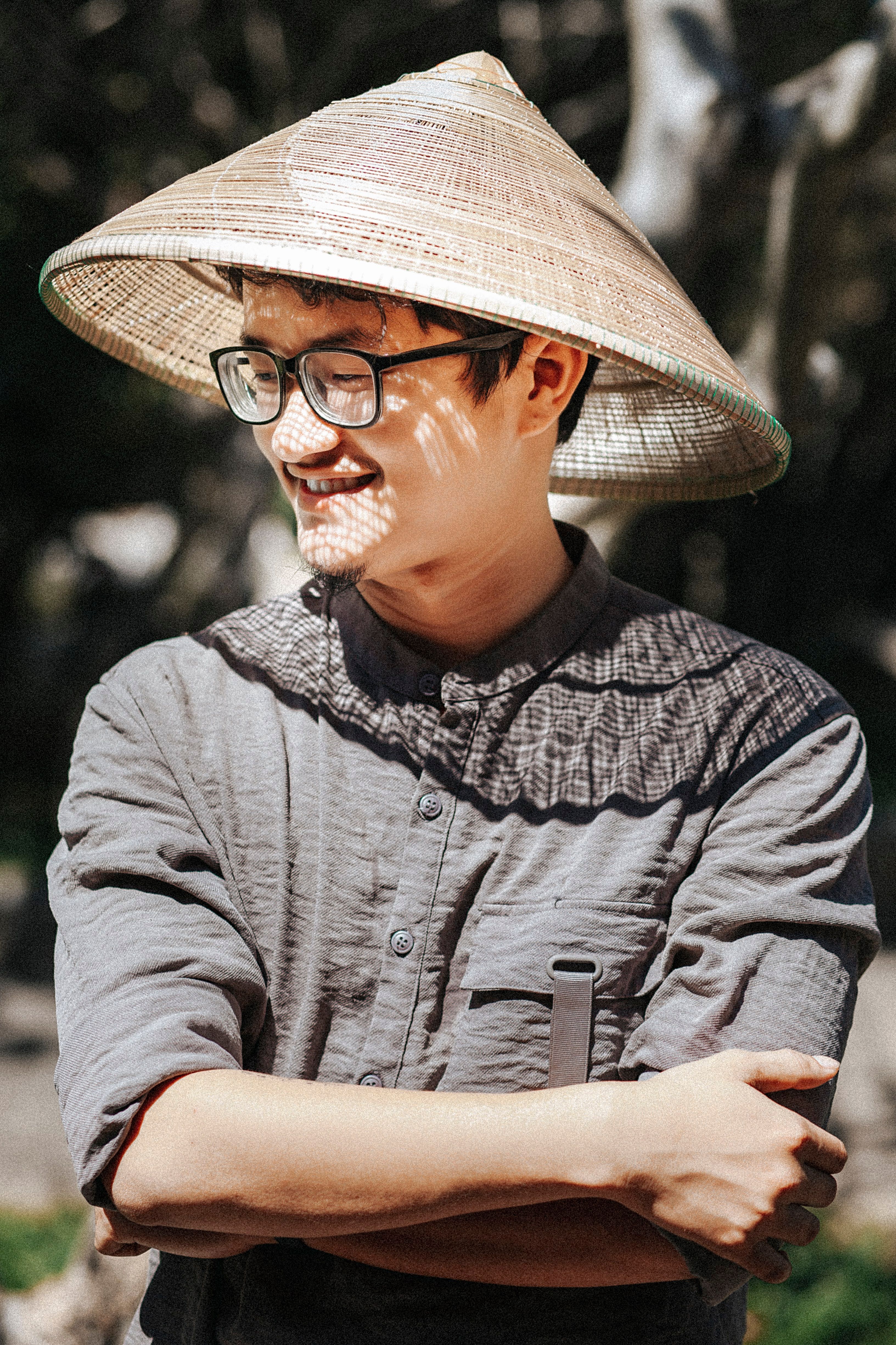 Portrait of Smiling Man in Conical Hat · Free Stock Photo